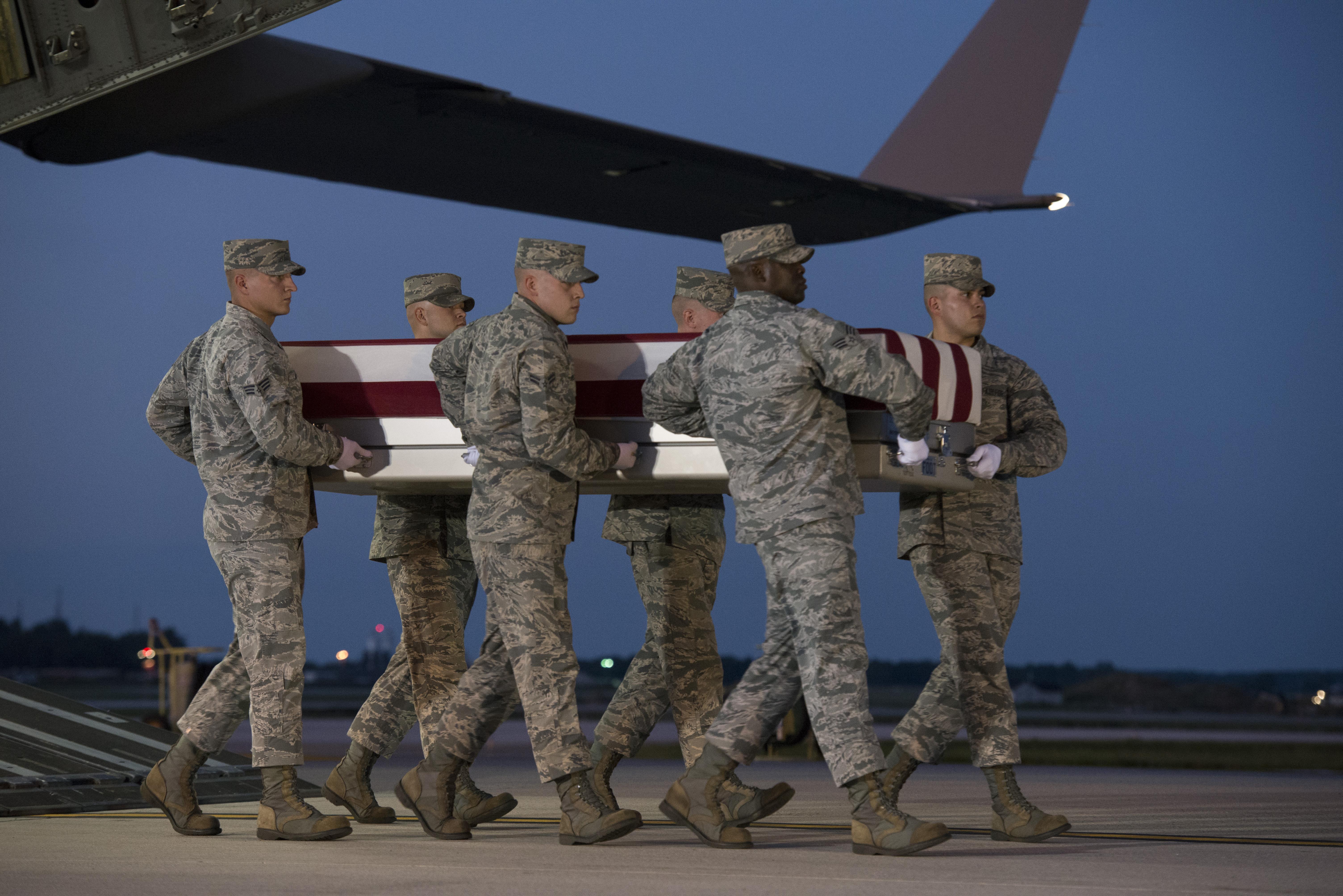 Air Force carry team carries the remains of Maj. Troy Gilbert