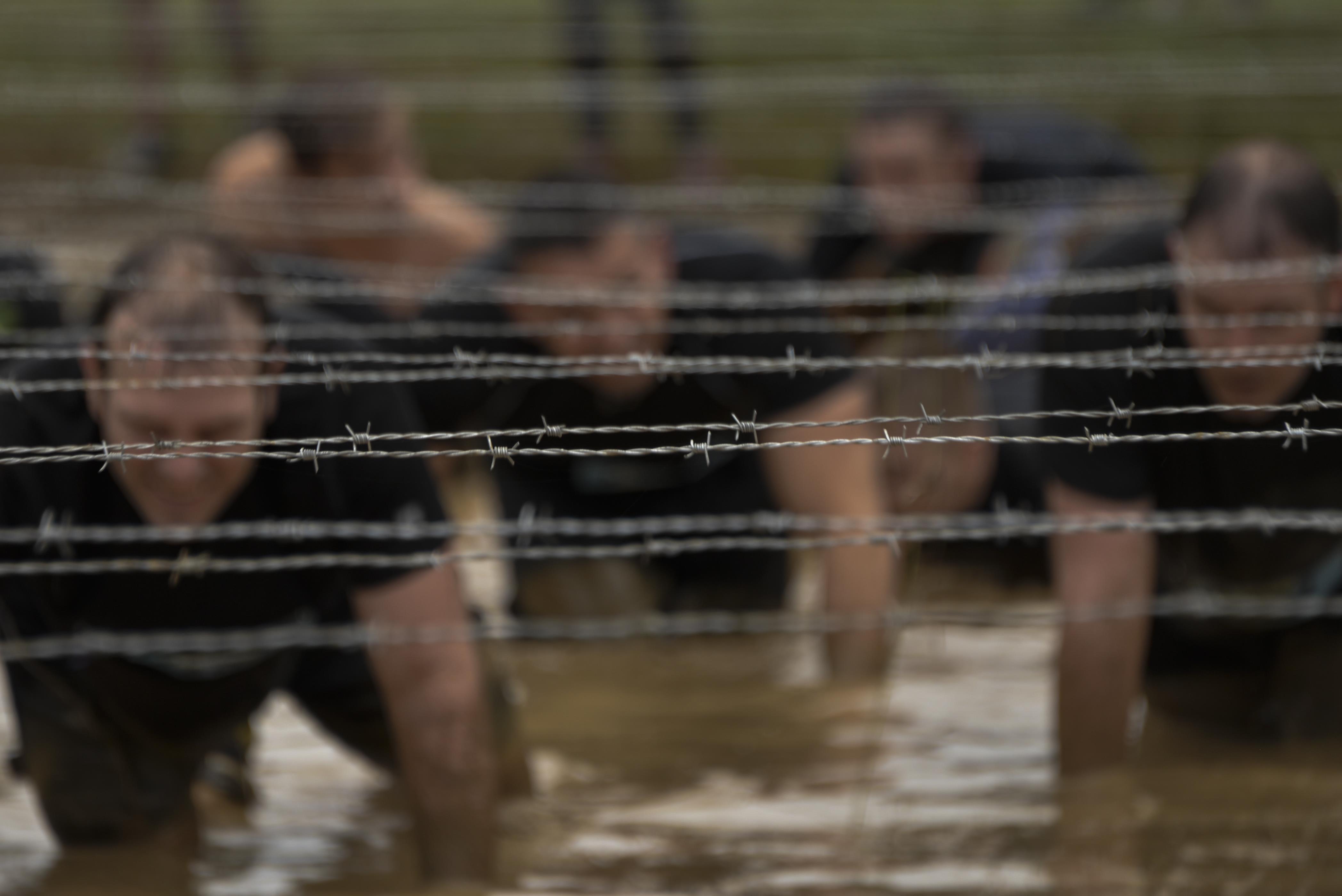 ISR Airmen get savage in obstacle mud run > Air Combat Command > News