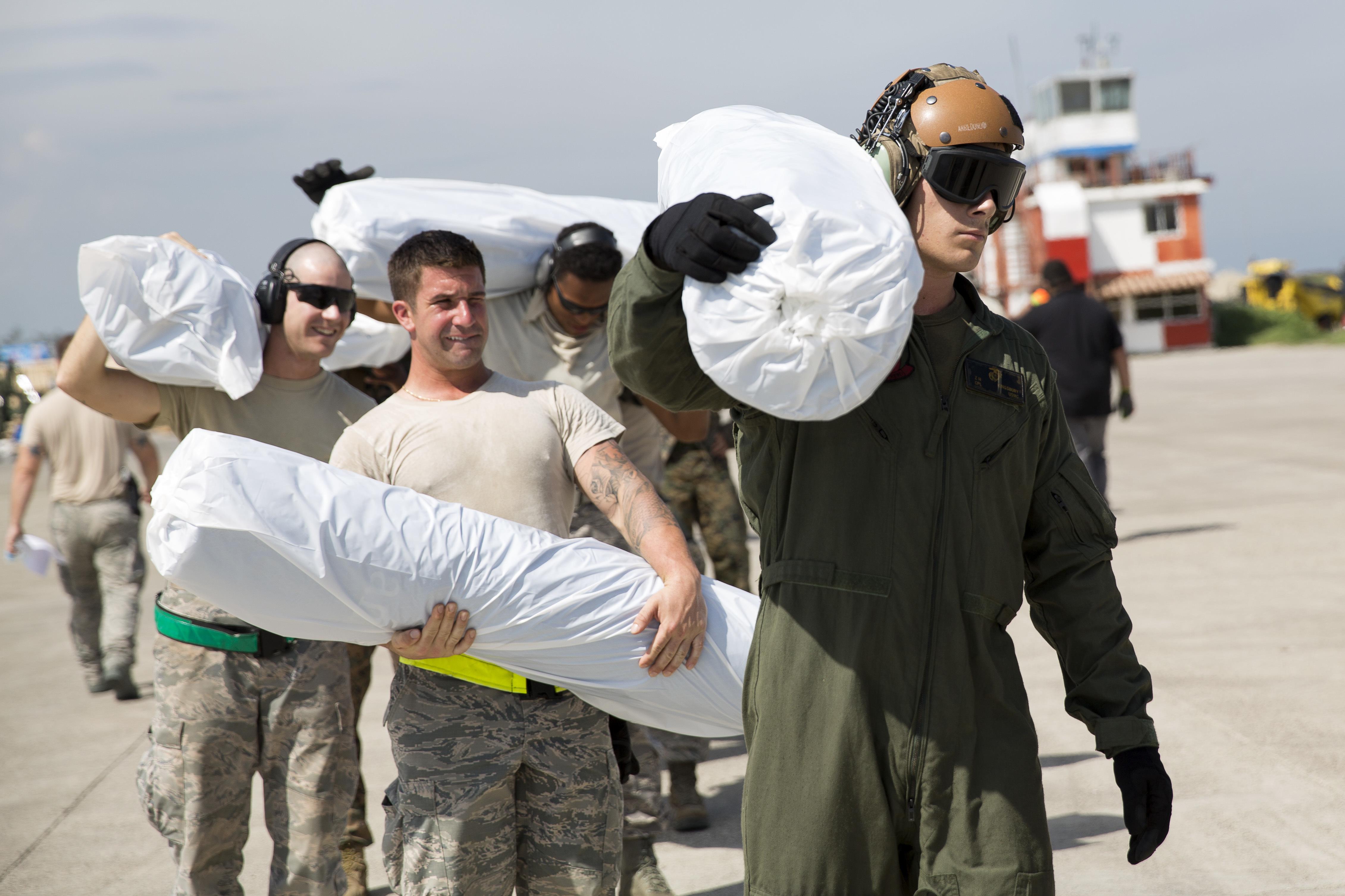 Loading Relief Supplies | U.S. Department of War