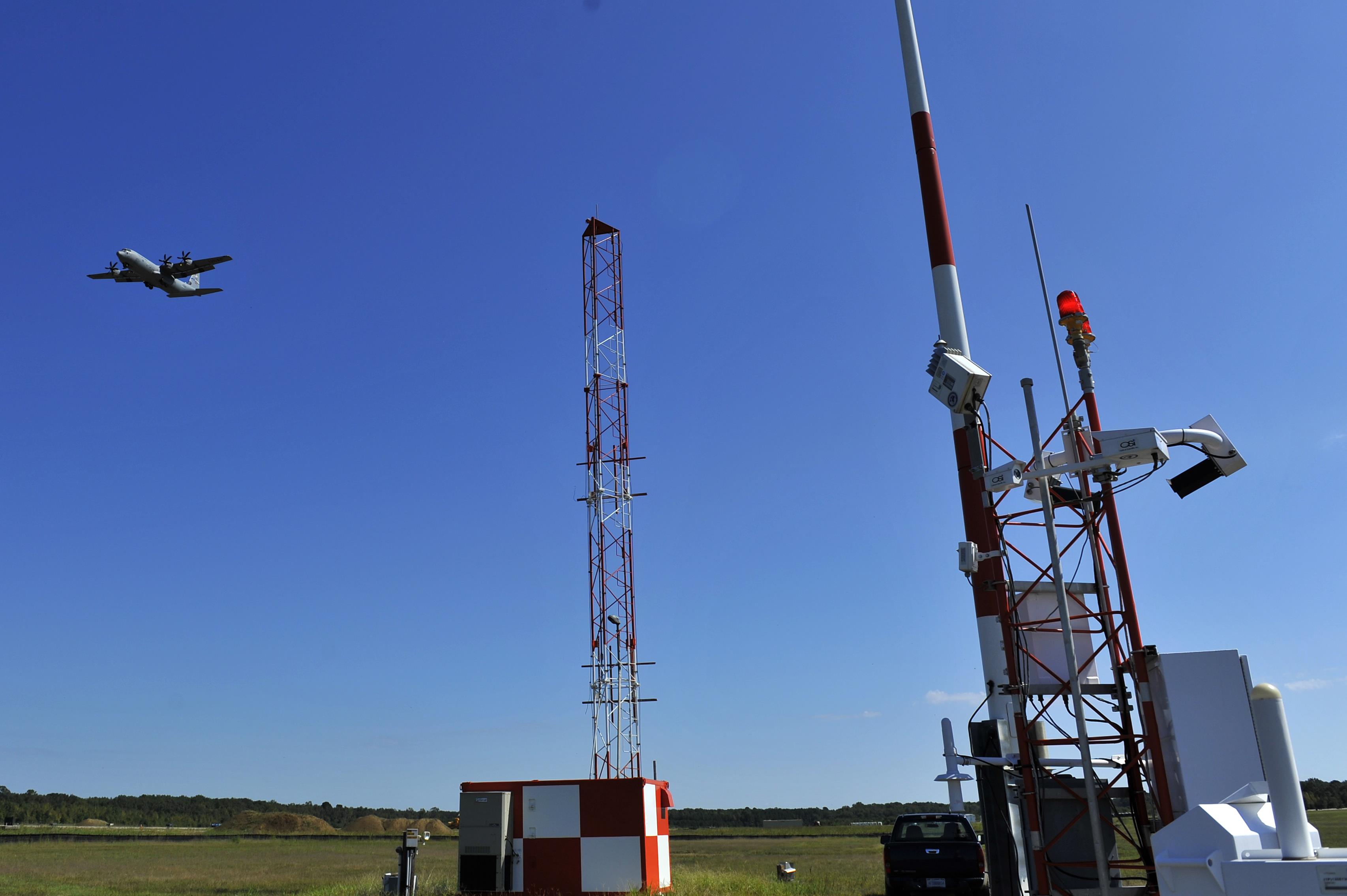 19th OSS airfield systems technicians climb radio tower