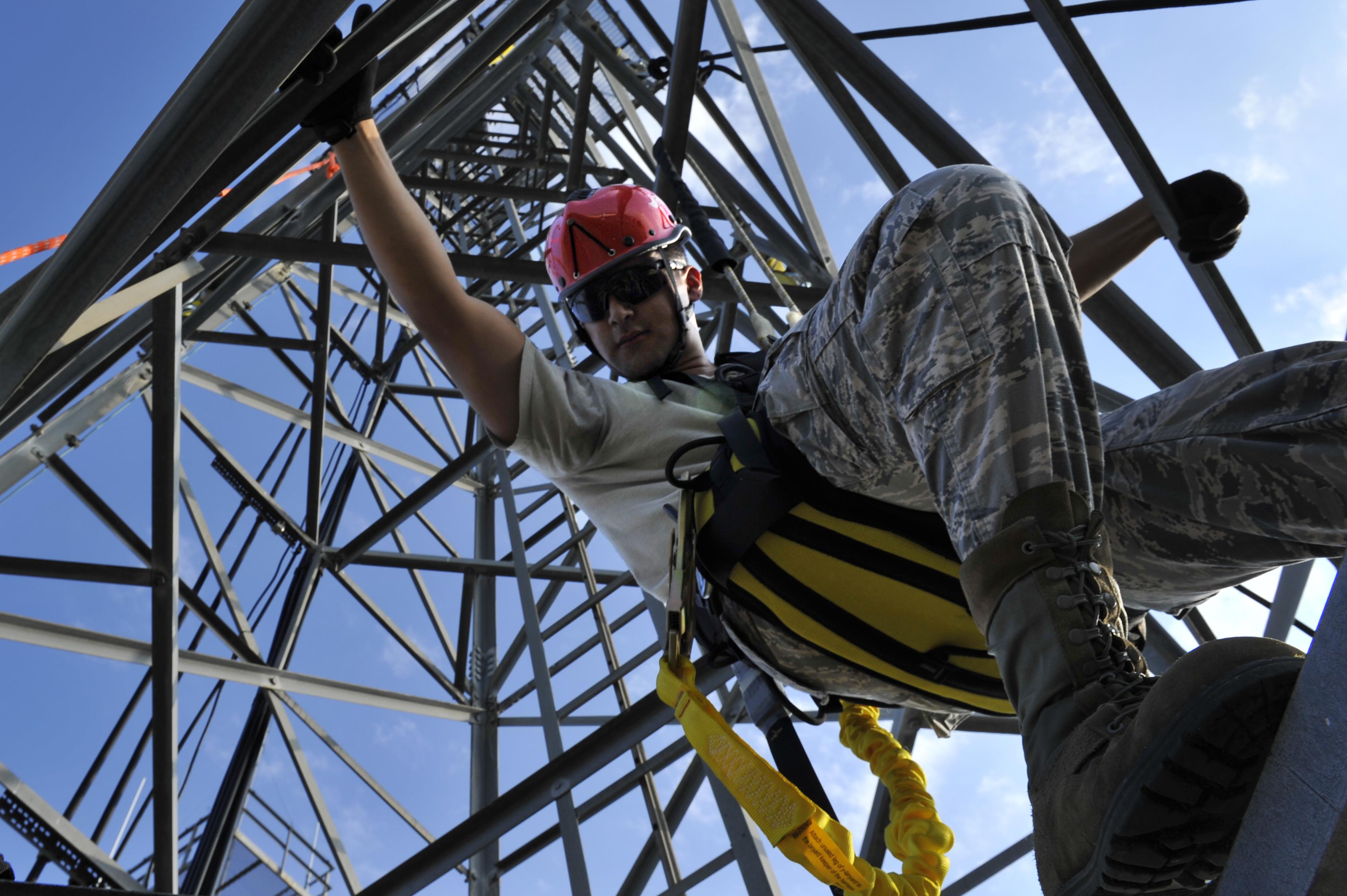 19th OSS airfield systems technicians climb radio tower