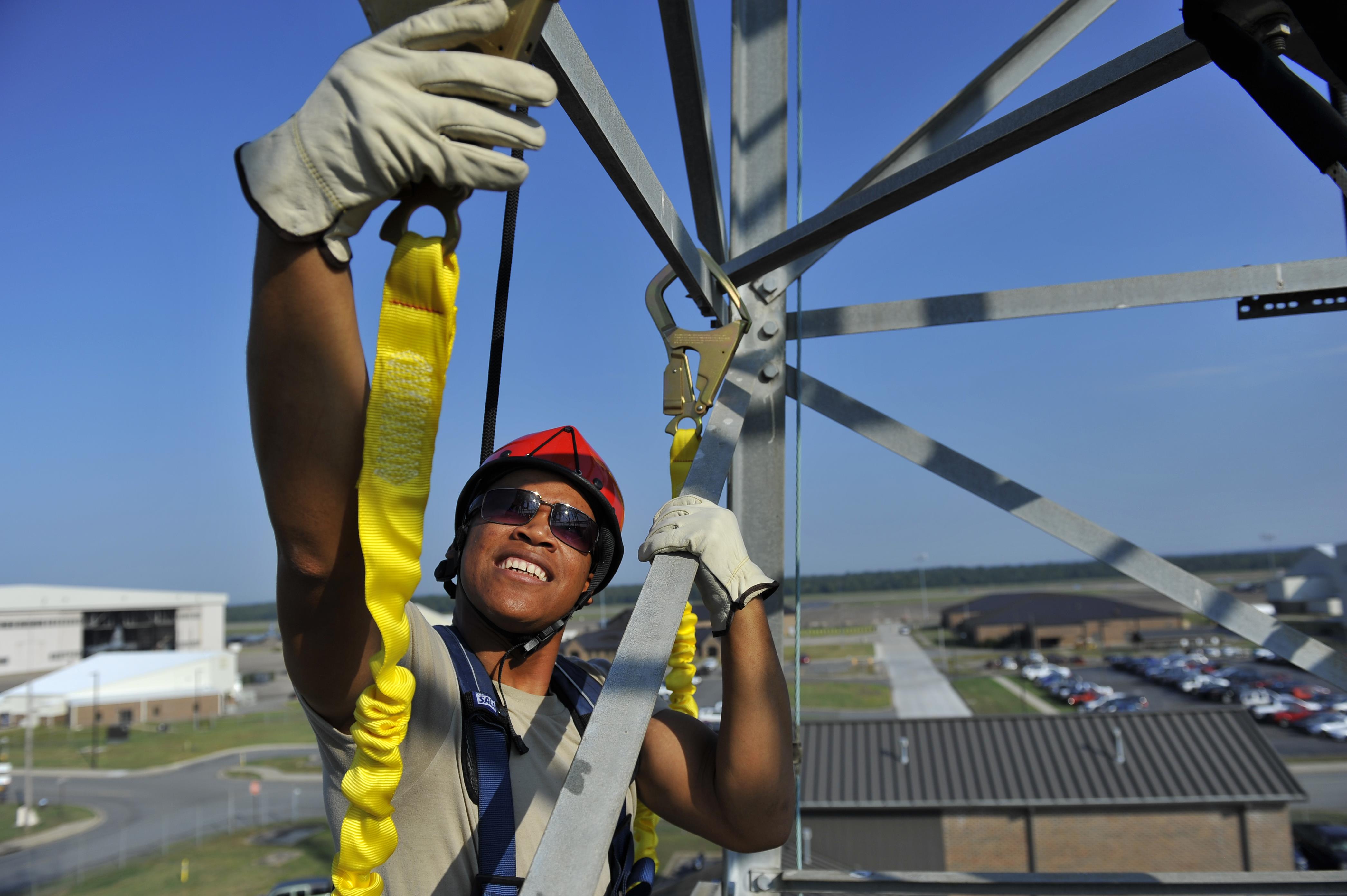 19th OSS airfield systems technicians climb radio tower