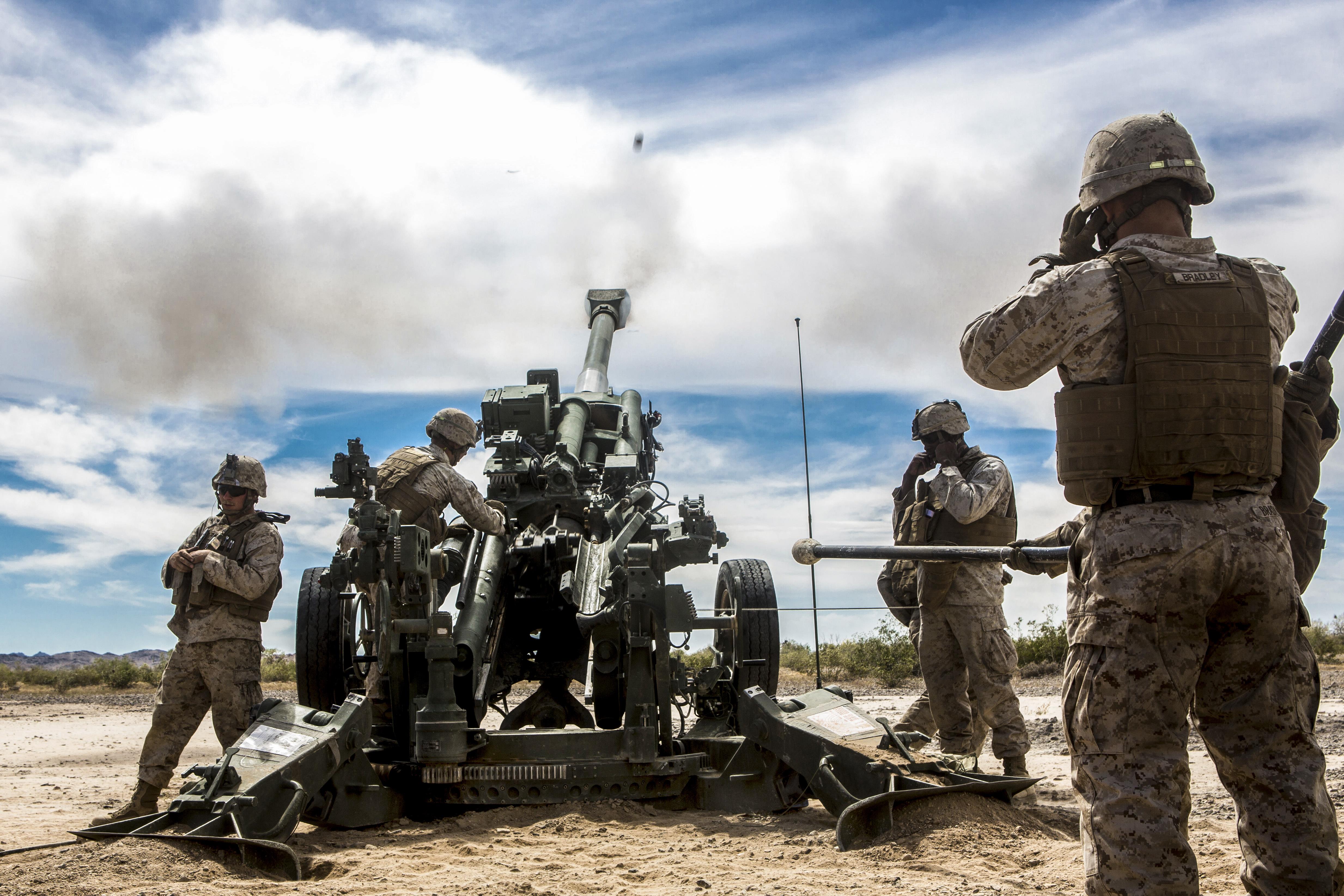 Marines fire an M777 towed 155 mm howitzer during an exercise as part ...