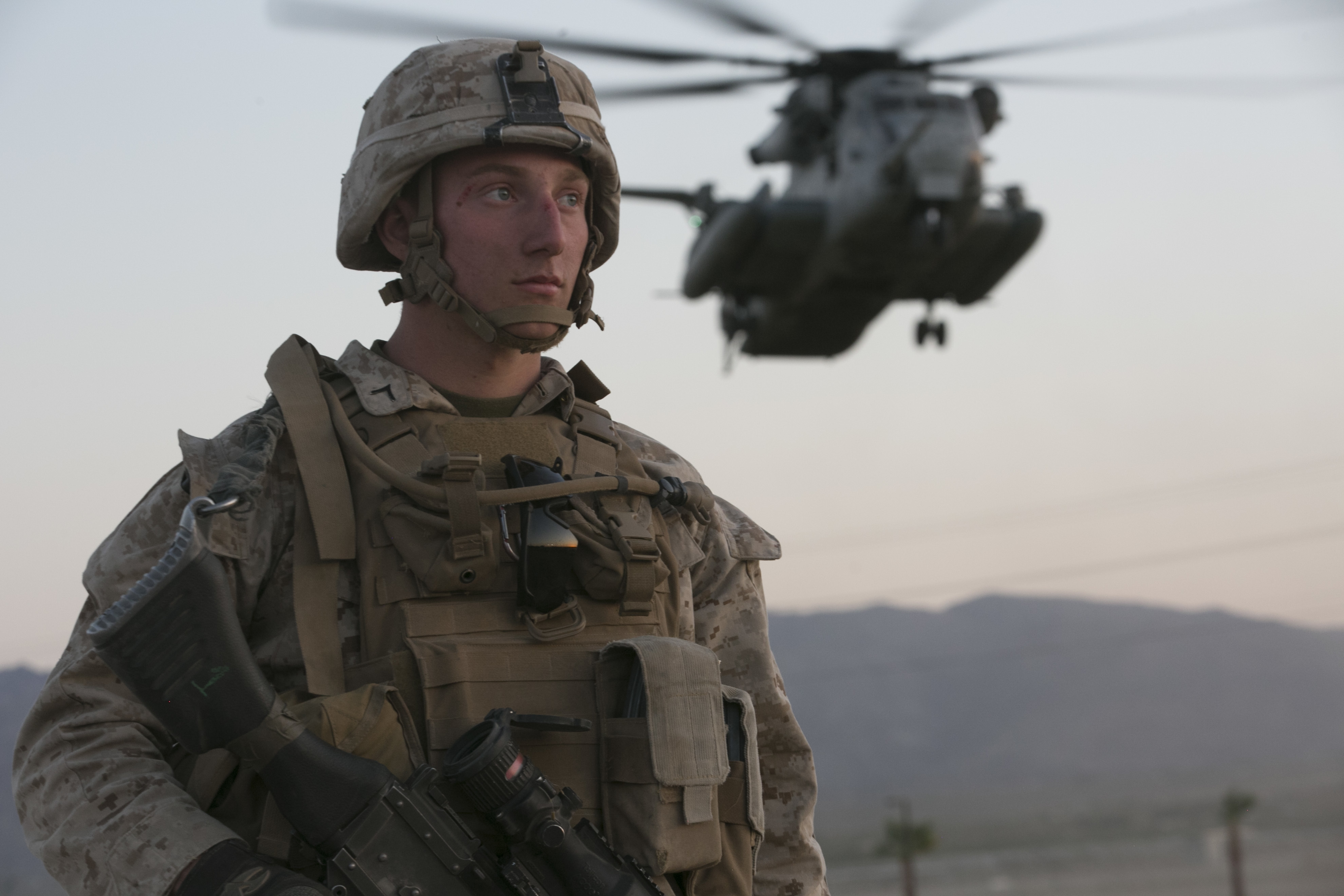 Pfc. Kelly, 2nd Batt., 6th Marine Reg., provides security as a CH-53 ...