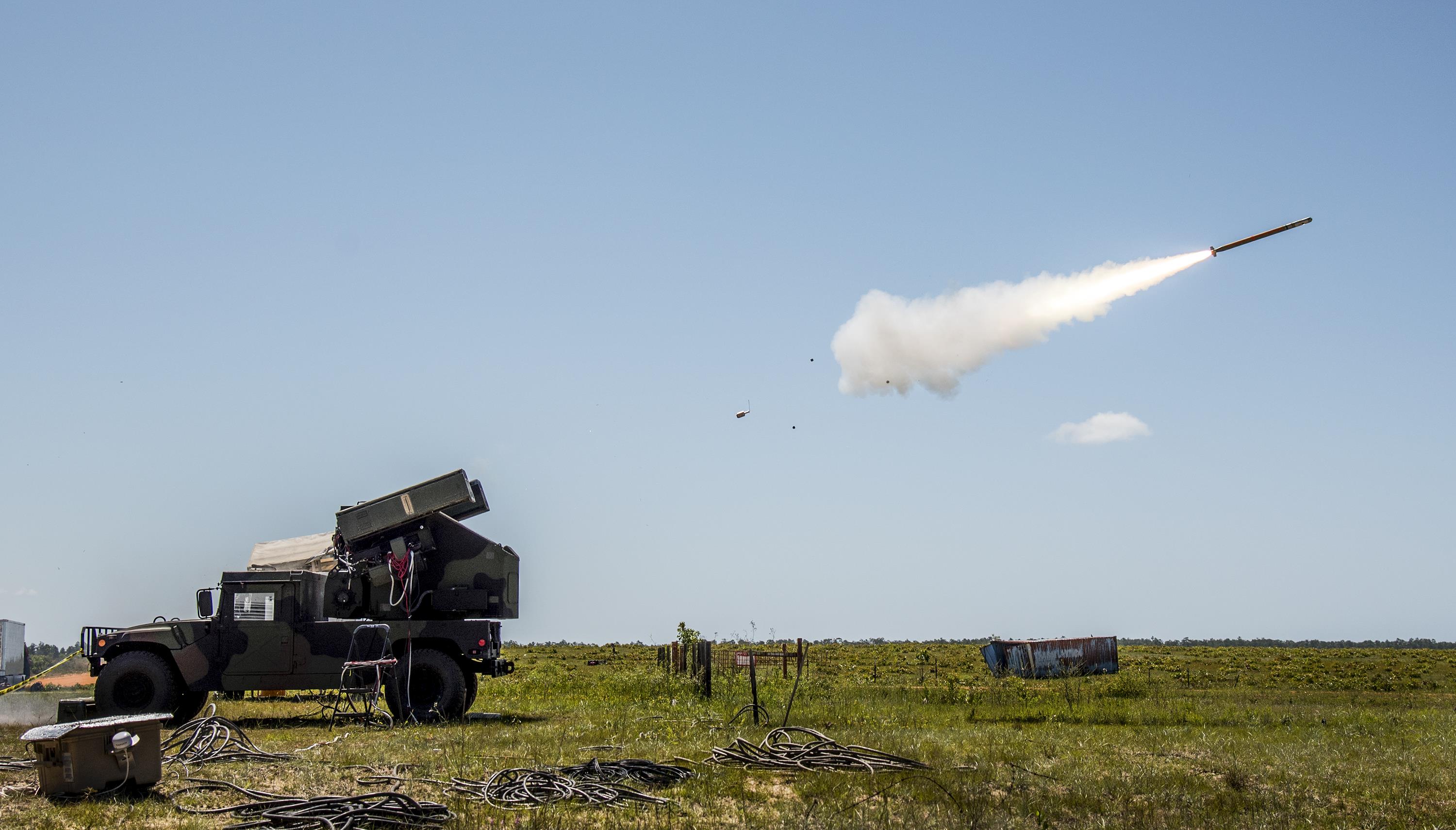 An FIM-92 Stinger missile is fired downrange from an Army Avenger ...