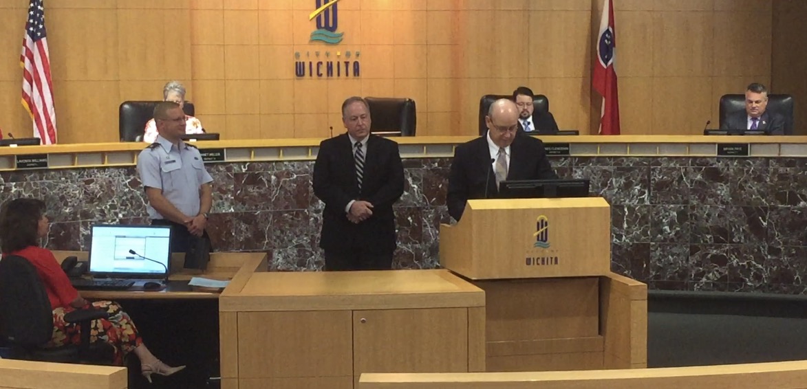 Dennis Fry is recognized by Mayor Longwell