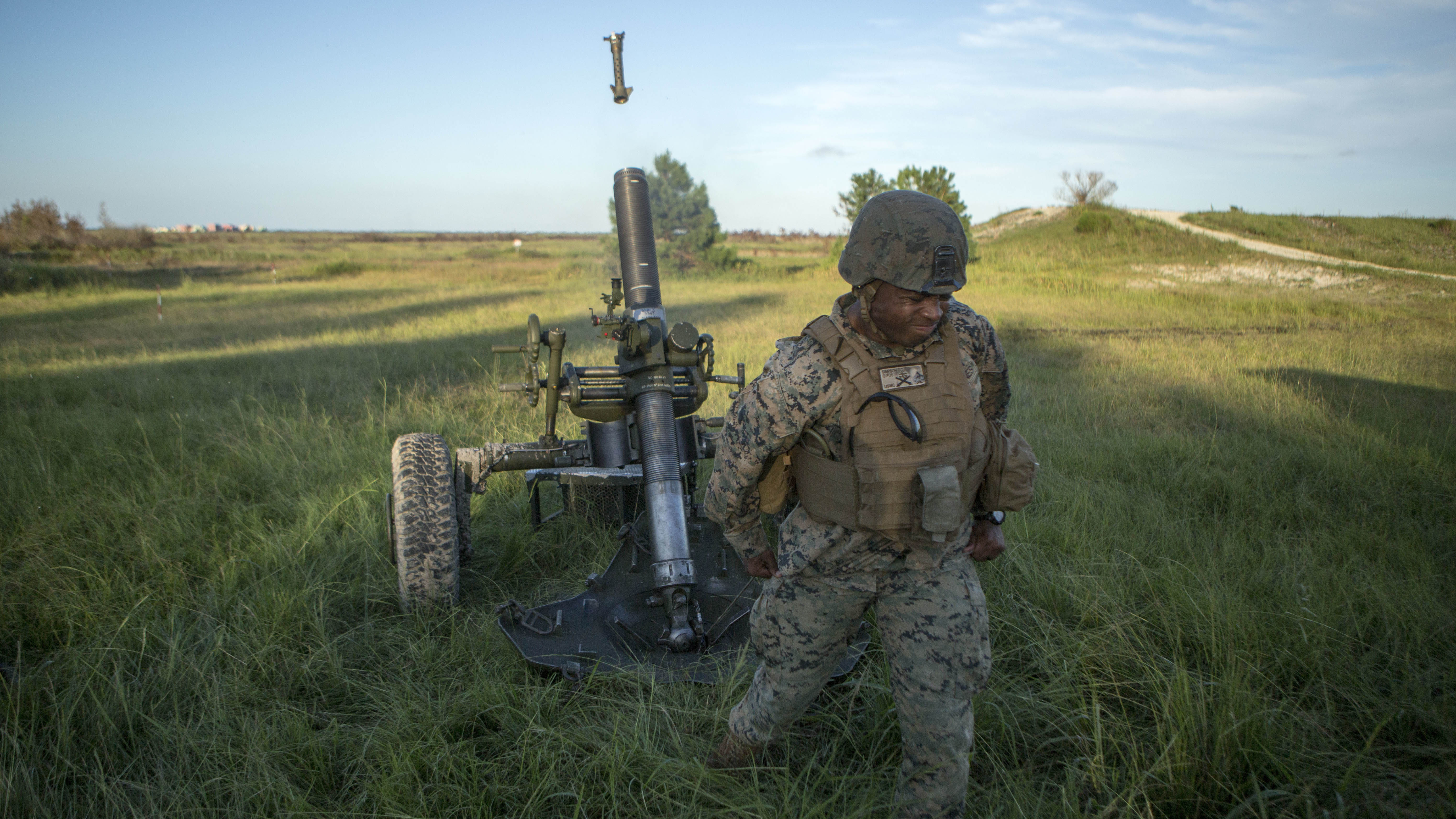 USMC Sgt. Simpson fires an M327 mortar during a live-fire training ...