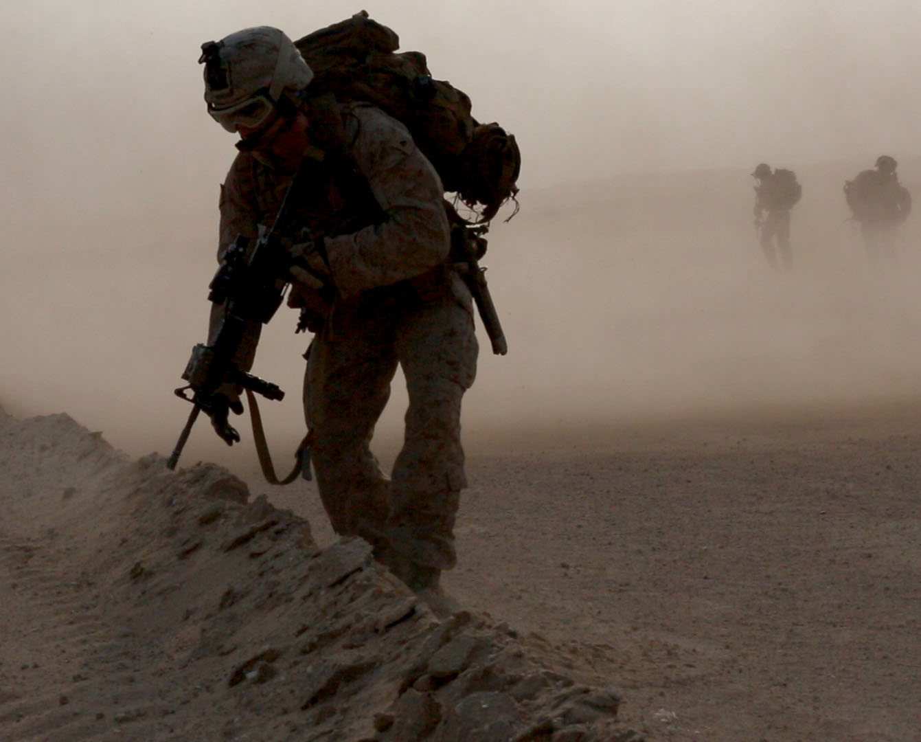 U.S. Marine with 3rd Battalion, 7th Marine Regiment, prepares to set up ...