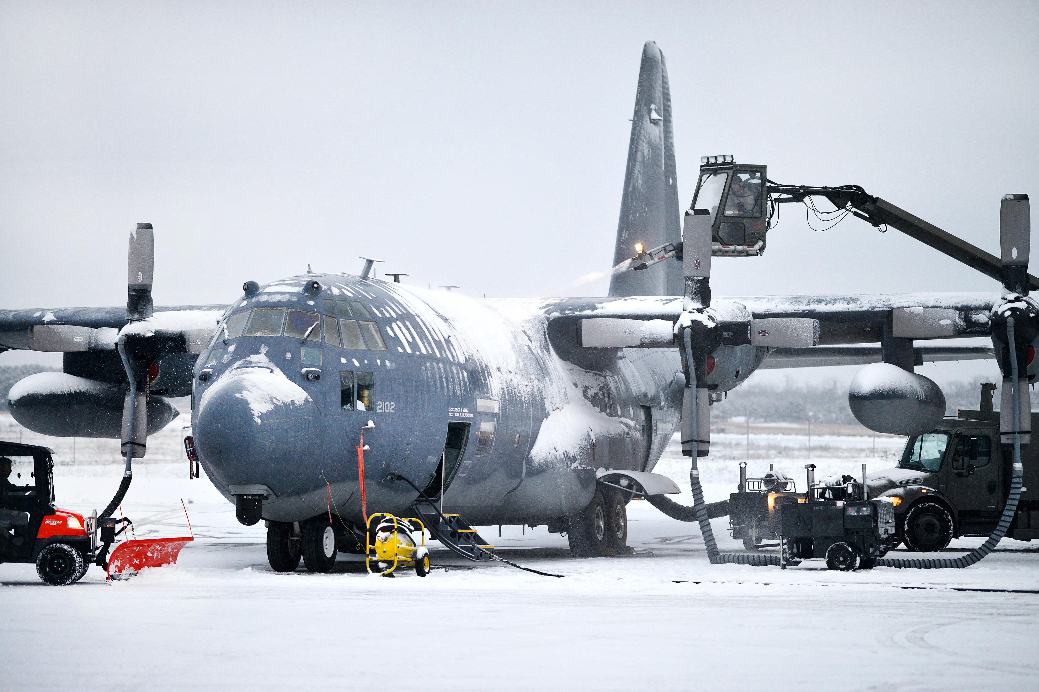 De-icing an HC-130 | U.S. Department of War