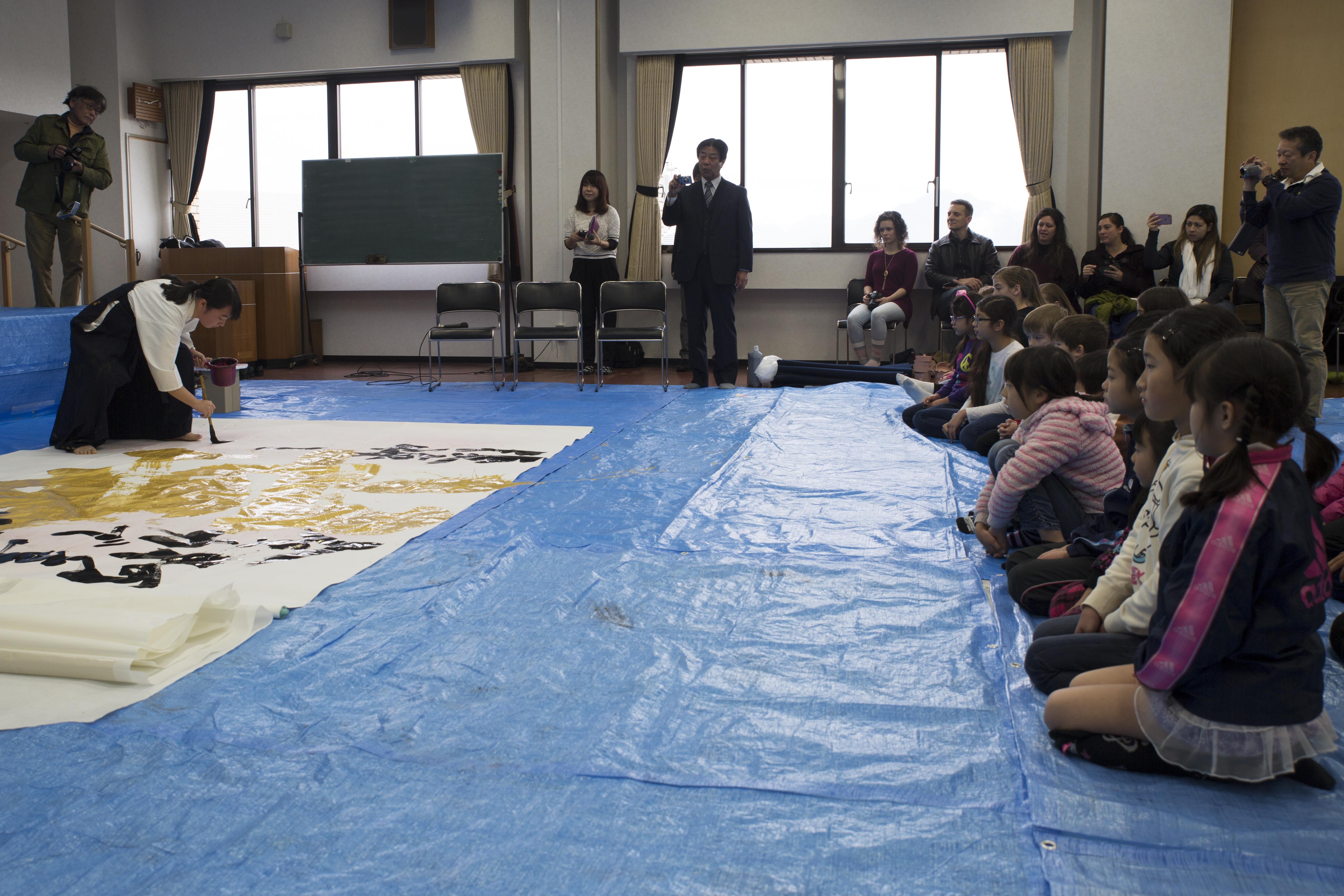Station residents, Japanese locals brush past 2016 with calligraphy ...