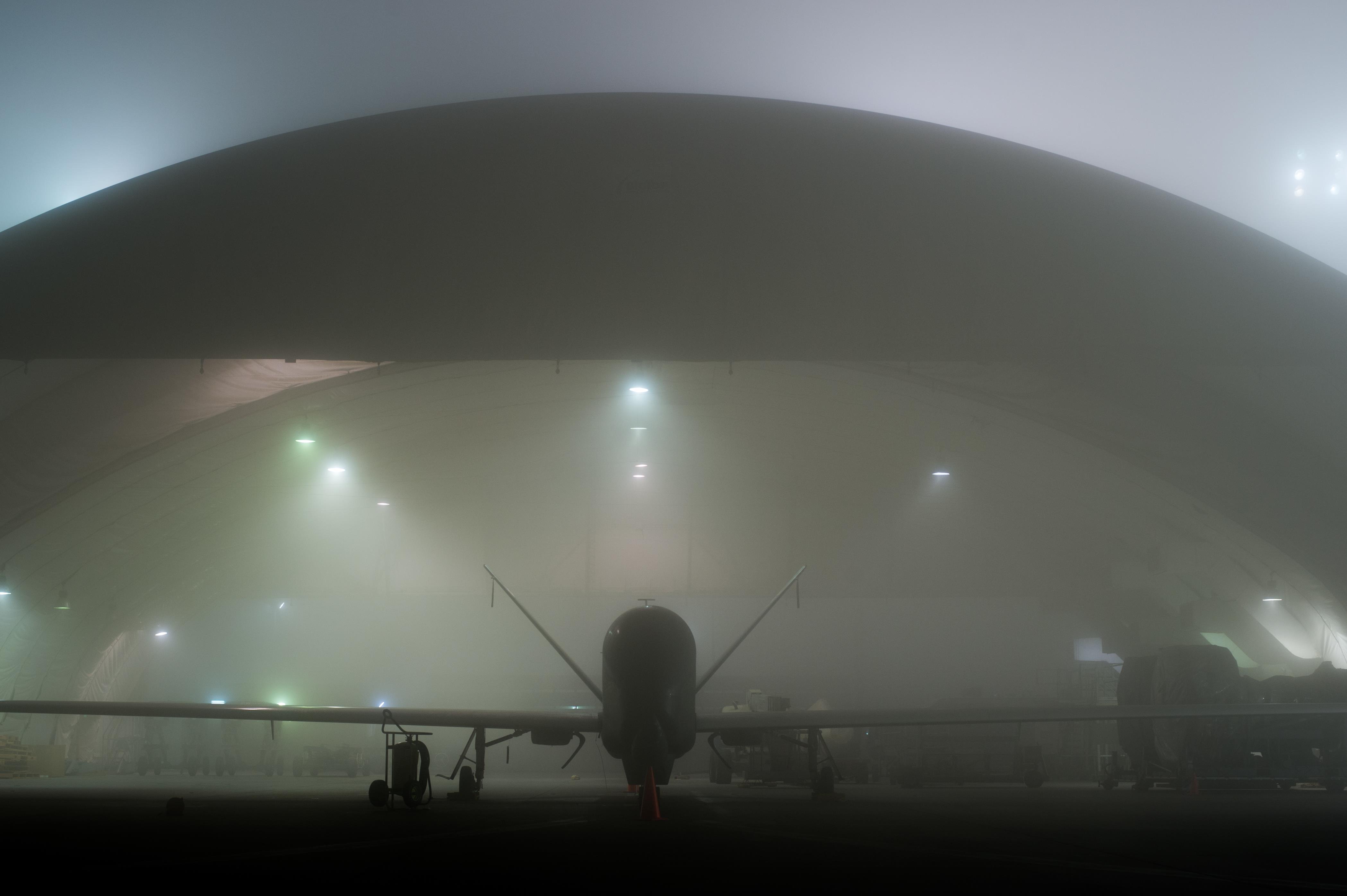 Under heavy fog, deployed maintainers repair aircraft engine in support ...