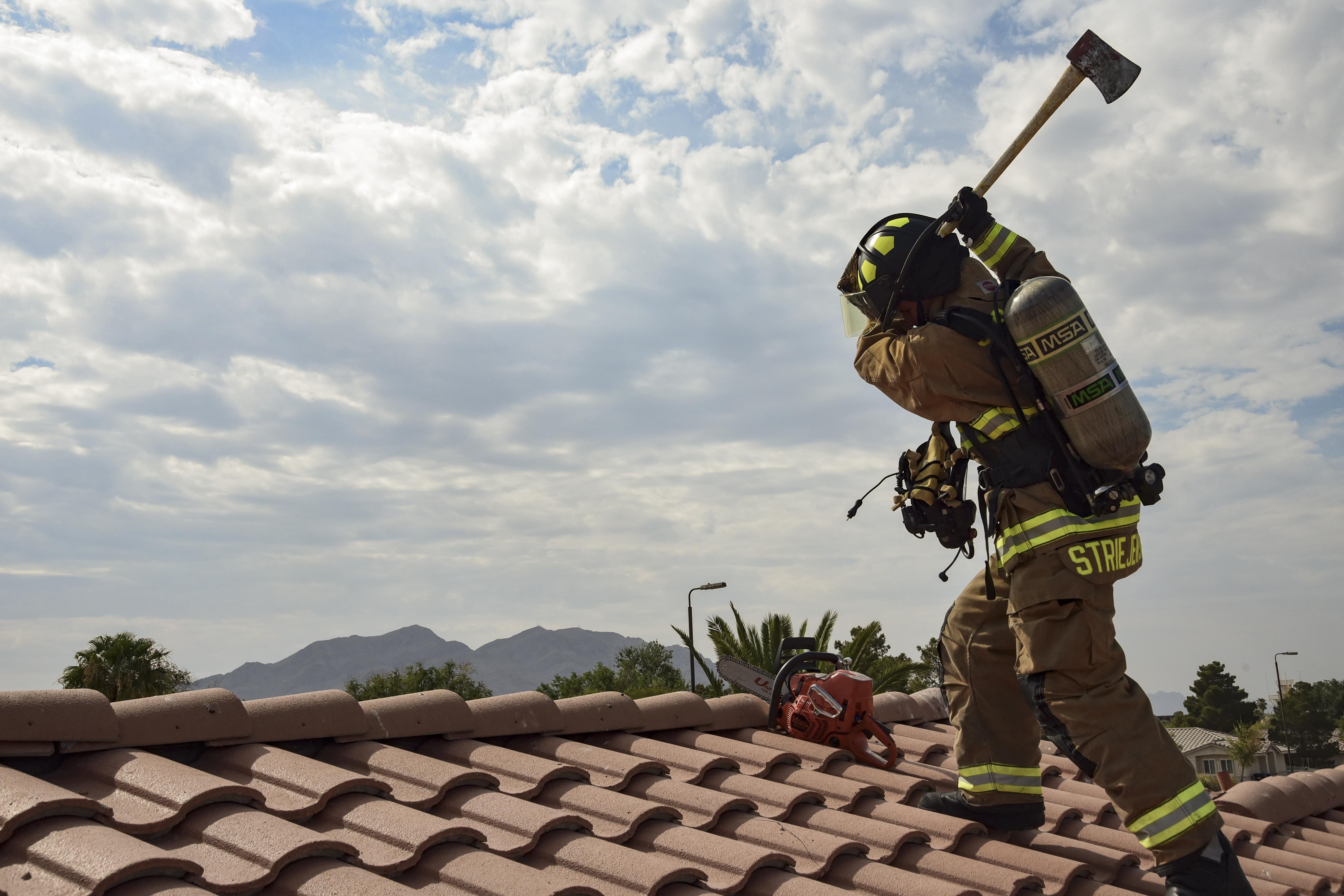 Firefighter On Roof