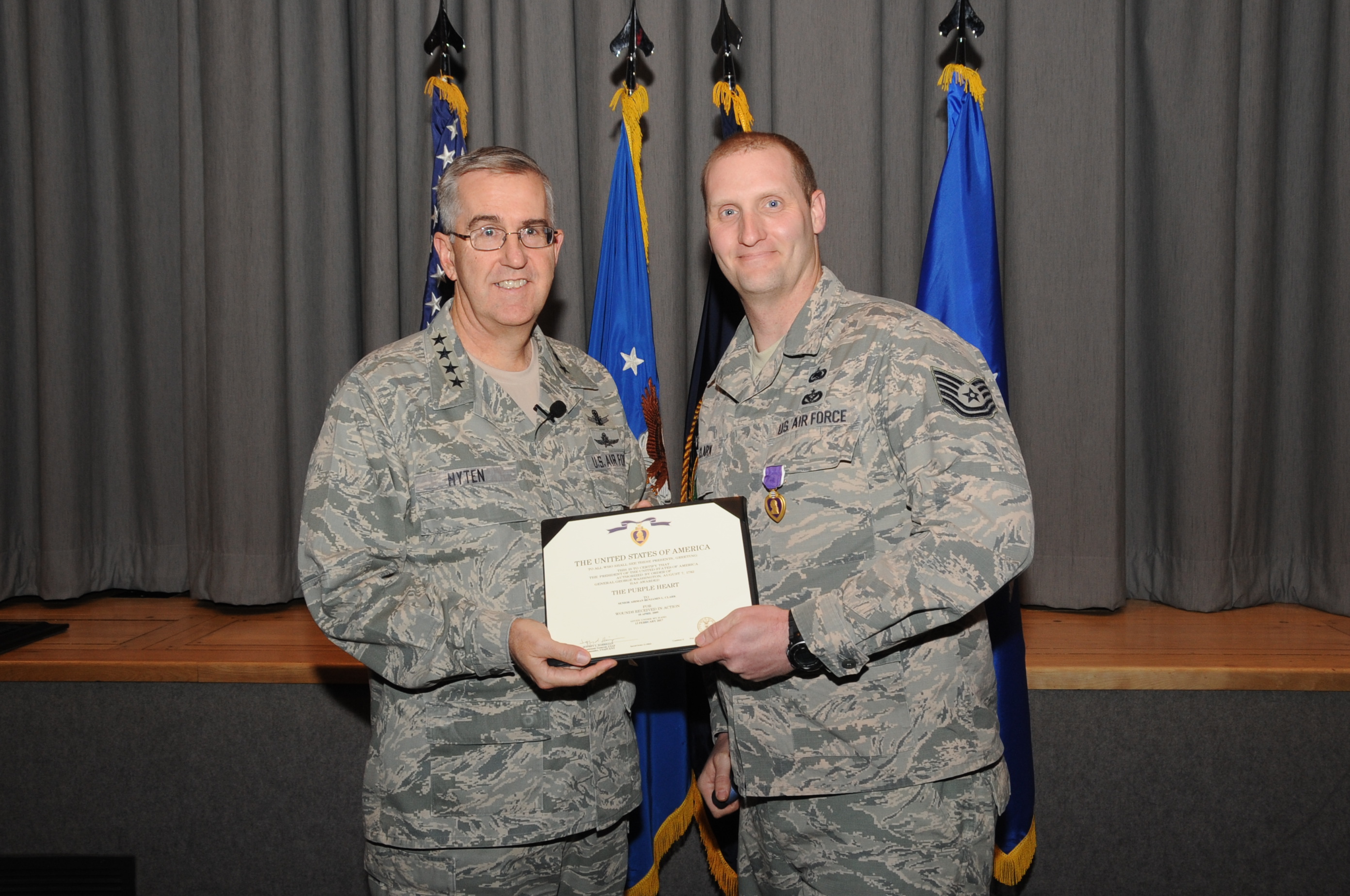 Gen Hyten presents Purple Heart to TSgt Clark