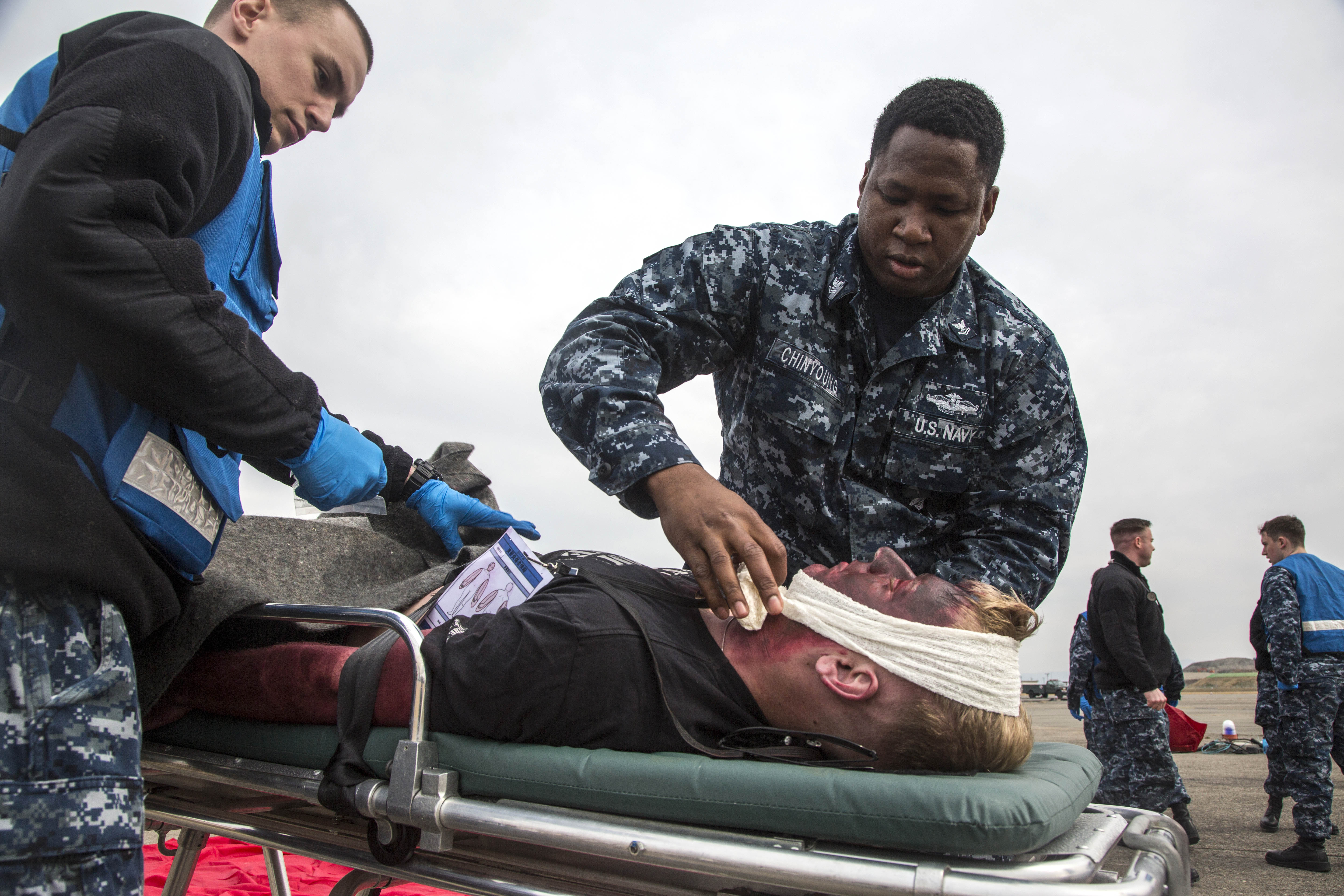 Bandaging a Patient | U.S. Department of War