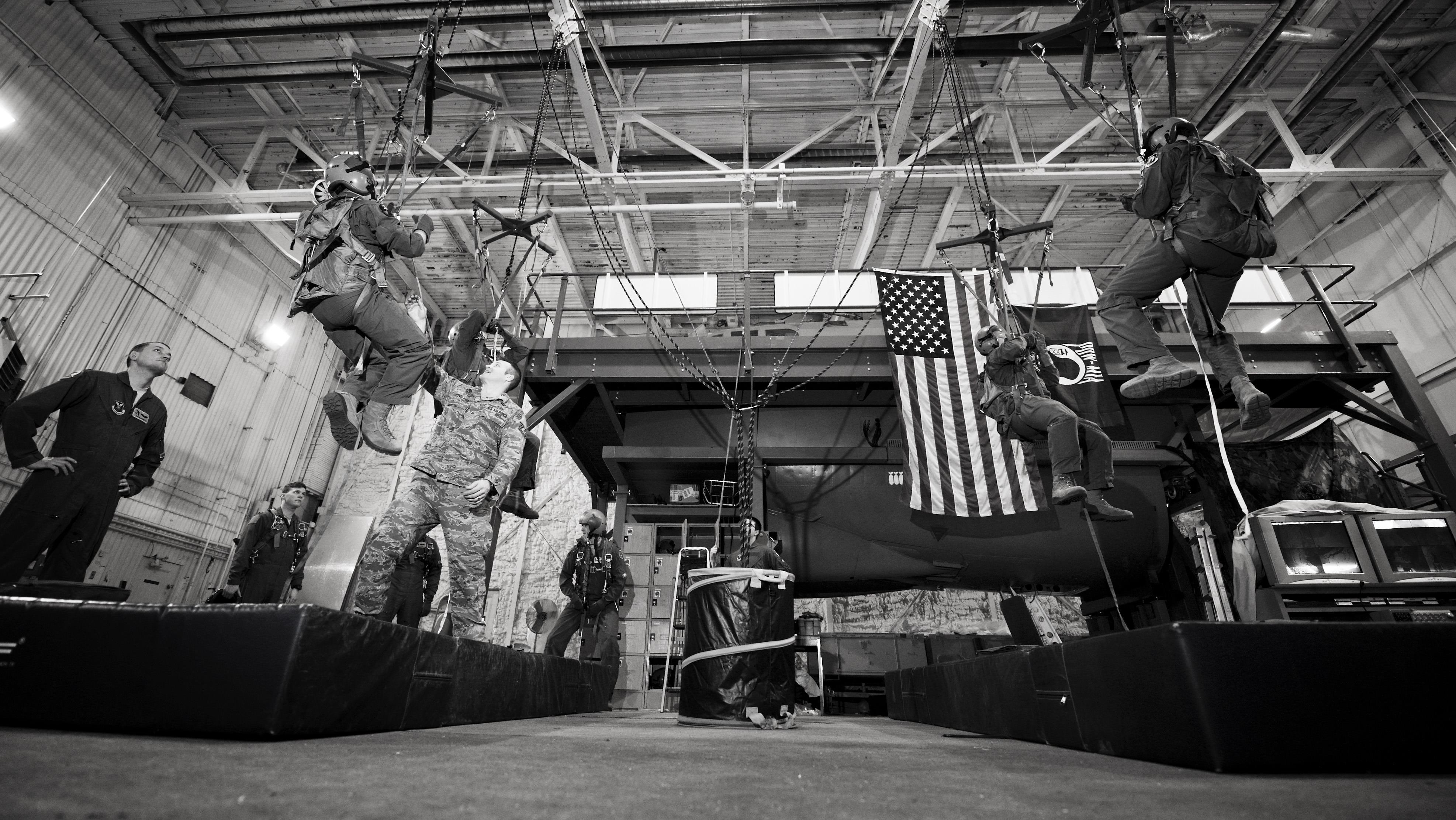 Aircrew participate in egress, emergency parachute training