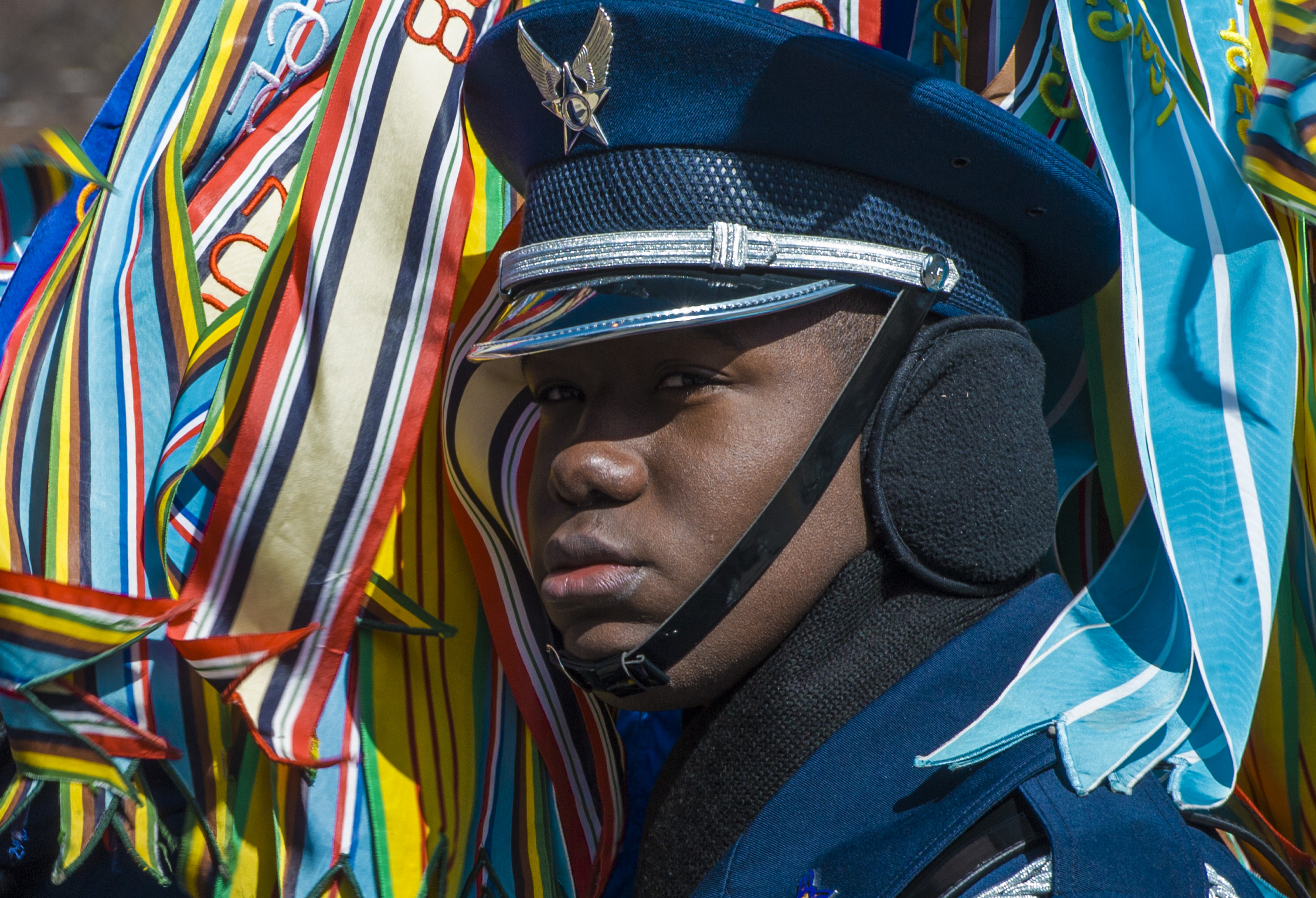 Ceremonial Guardsman peers through colorful streamers