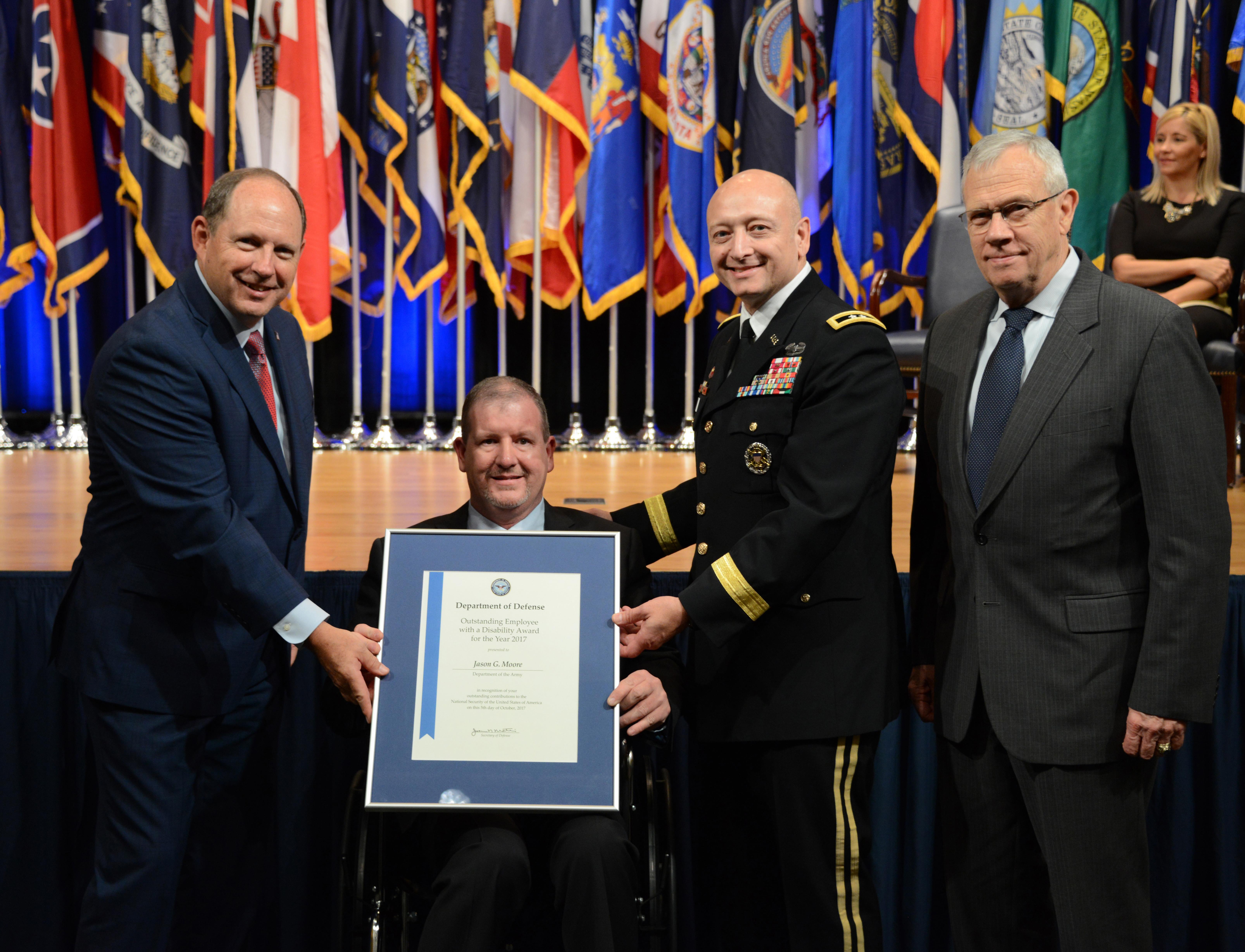 Systems engineer overcomes adversity, recognized by Secretary of ...