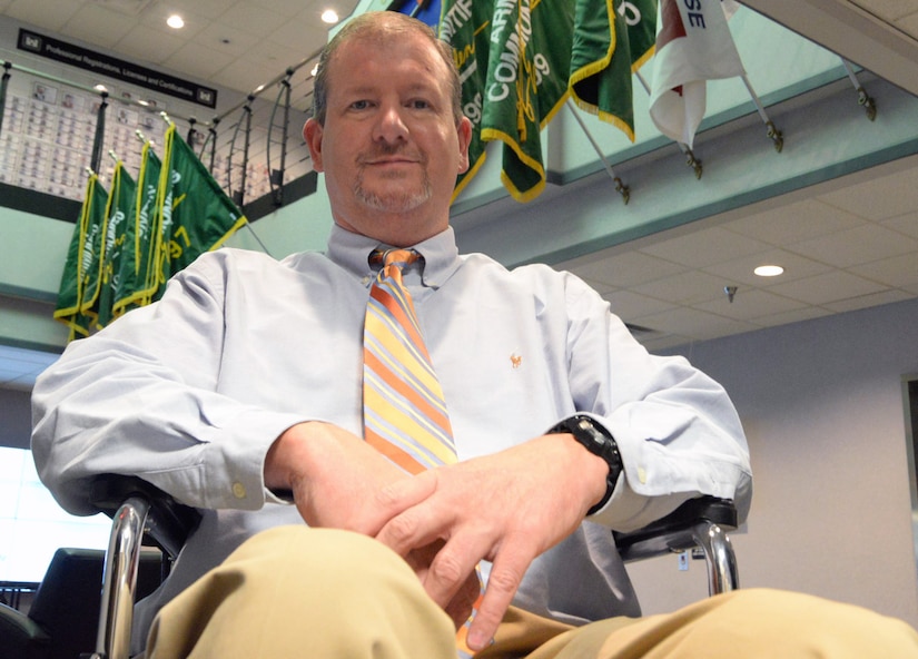 Systems engineer overcomes adversity, recognized by Secretary of ...