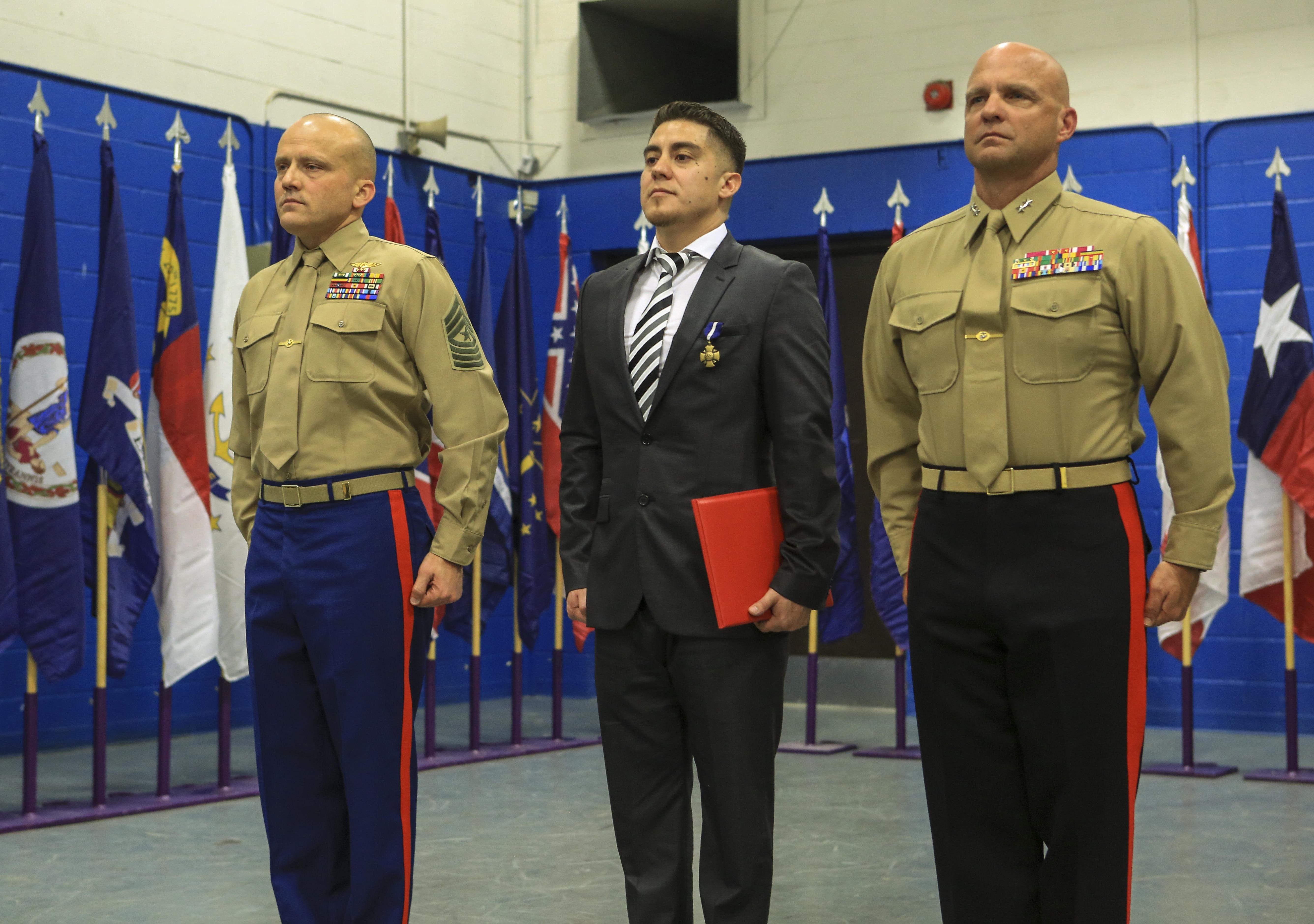 Marine Corps veteran Lance Cpl. Gonzalez receives award upgrade to Navy ...