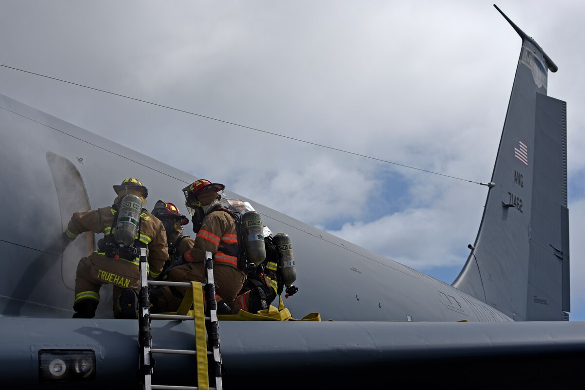 Andersen AFB Fire Department conducts an aircraft egress exercise ...