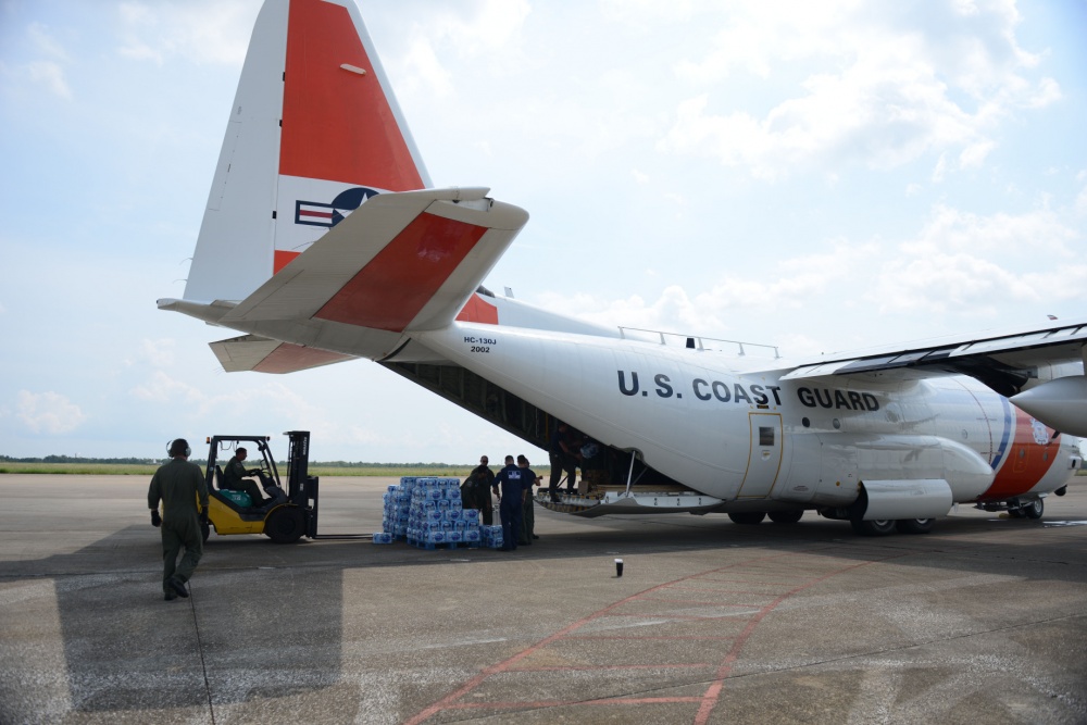 Coast Guard HC-130 Hercules aircrew offloads 21,000 pounds of bottled ...