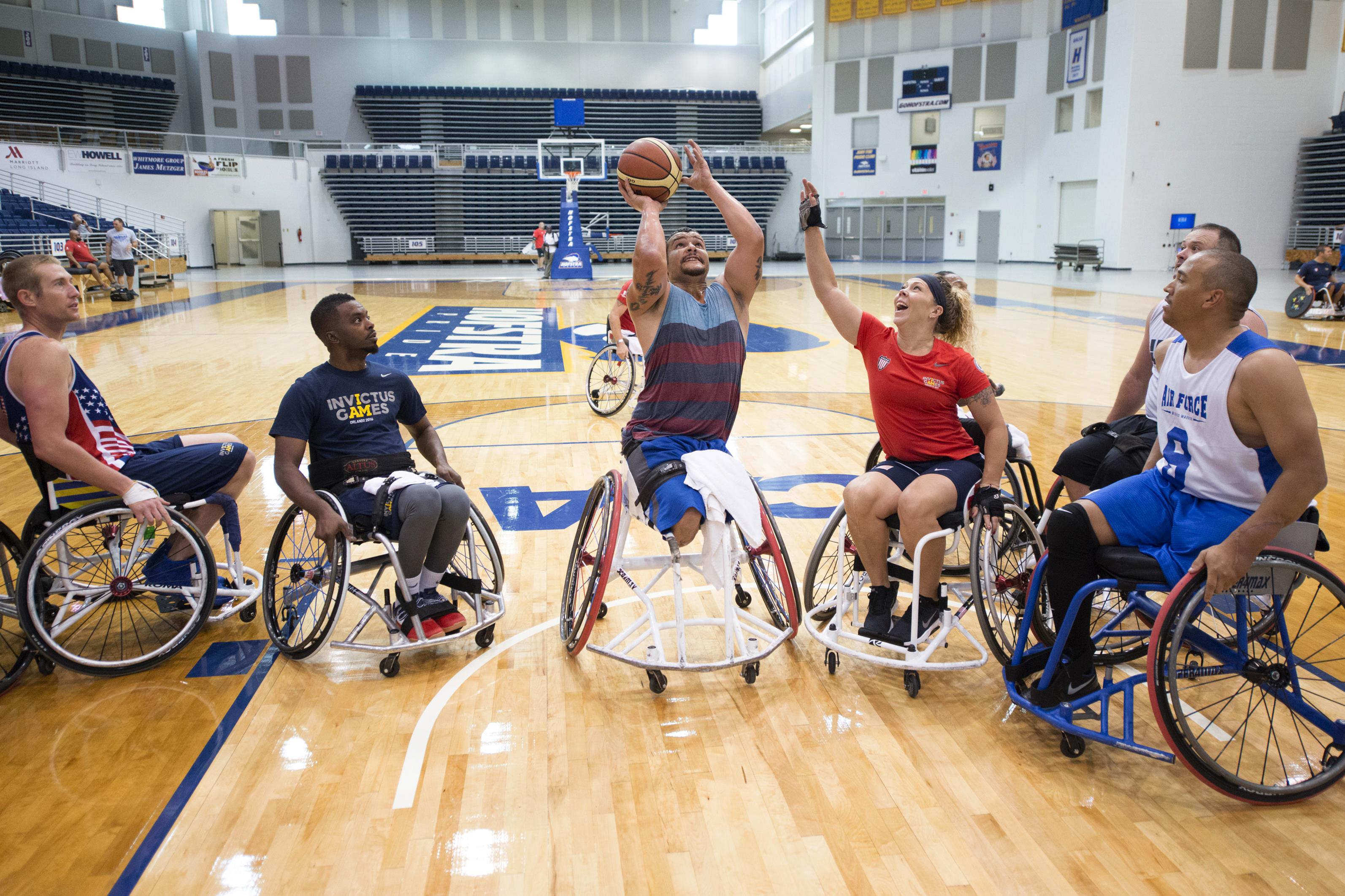 People In Wheelchairs Playing Basketball