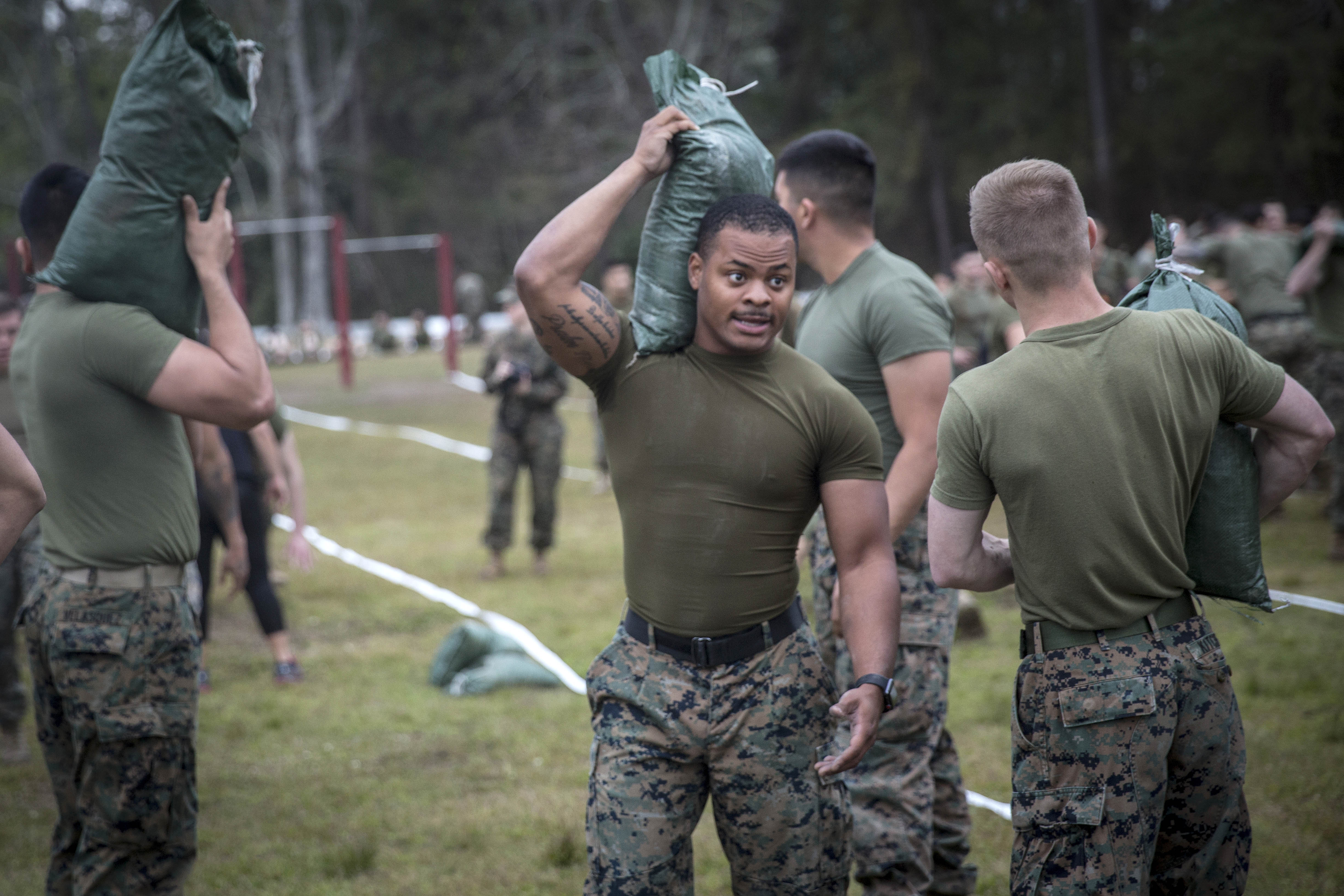 Carrying Sandbags | U.S. Department of War