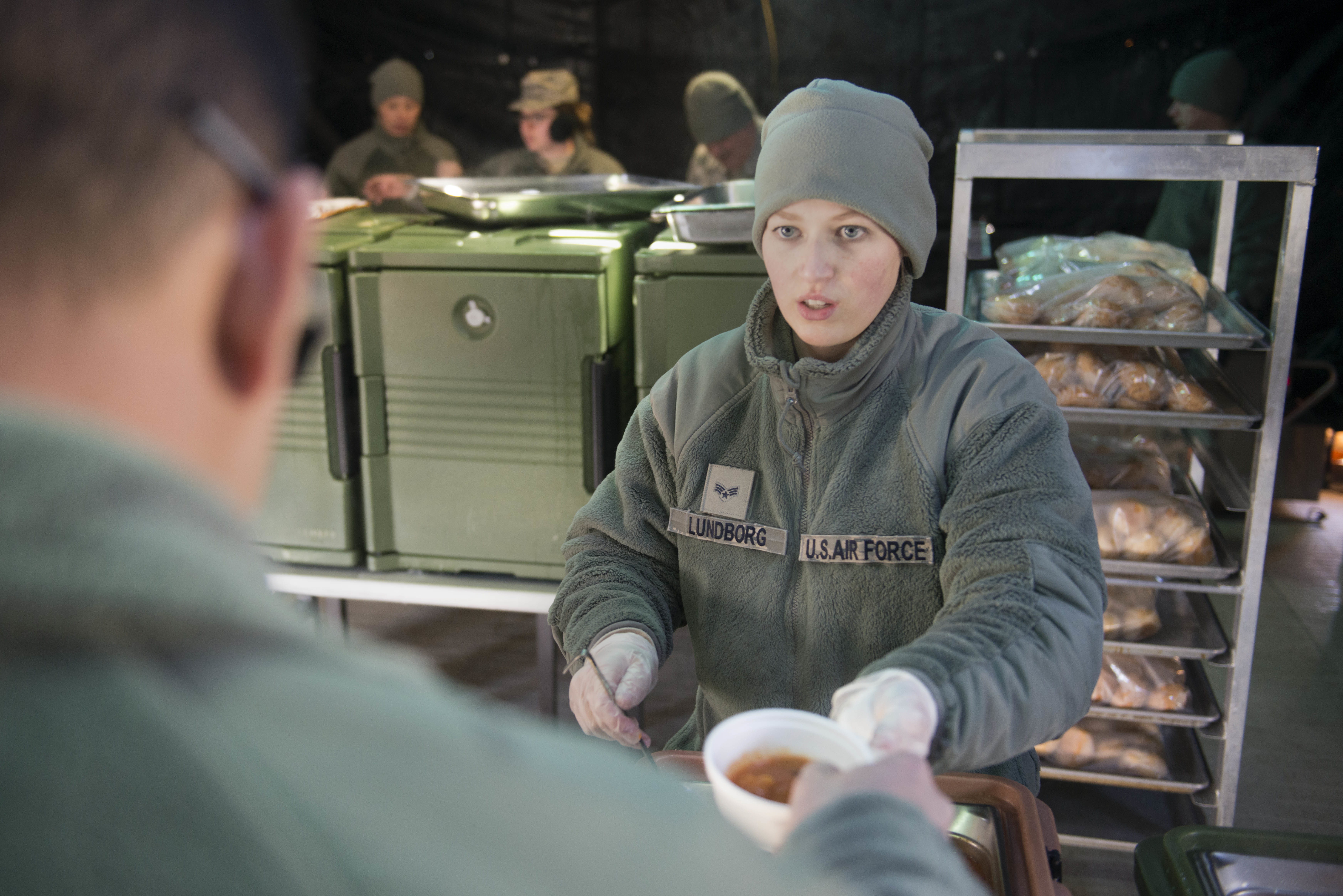Airmen serve food in the field during Hennessy competition ...