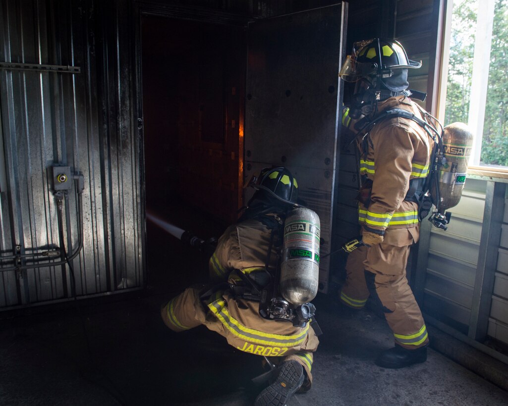 Air Force fire protection specialists conduct wartime-firefighting ...