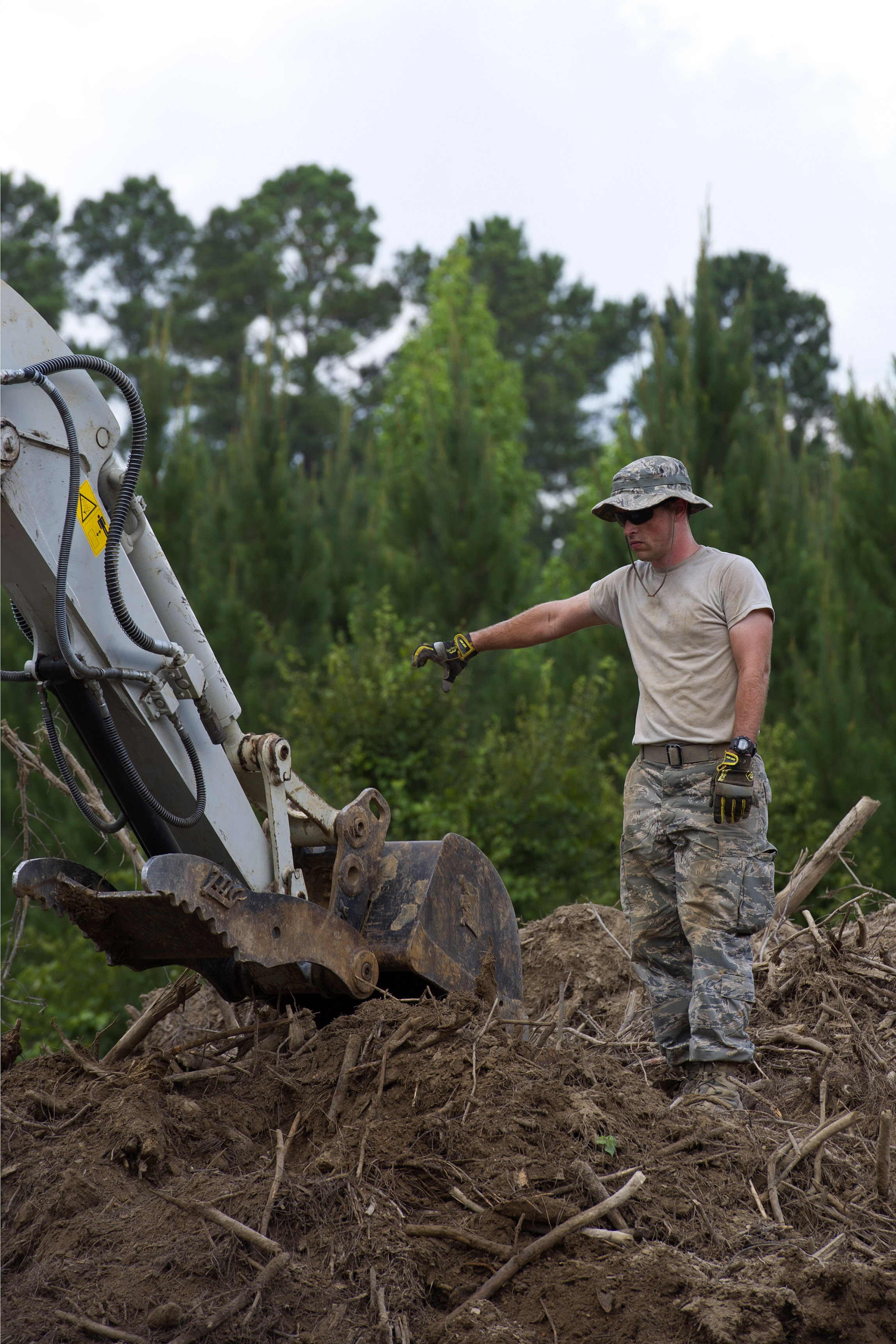 Guiding Backhoe Operator | U.S. Department of War
