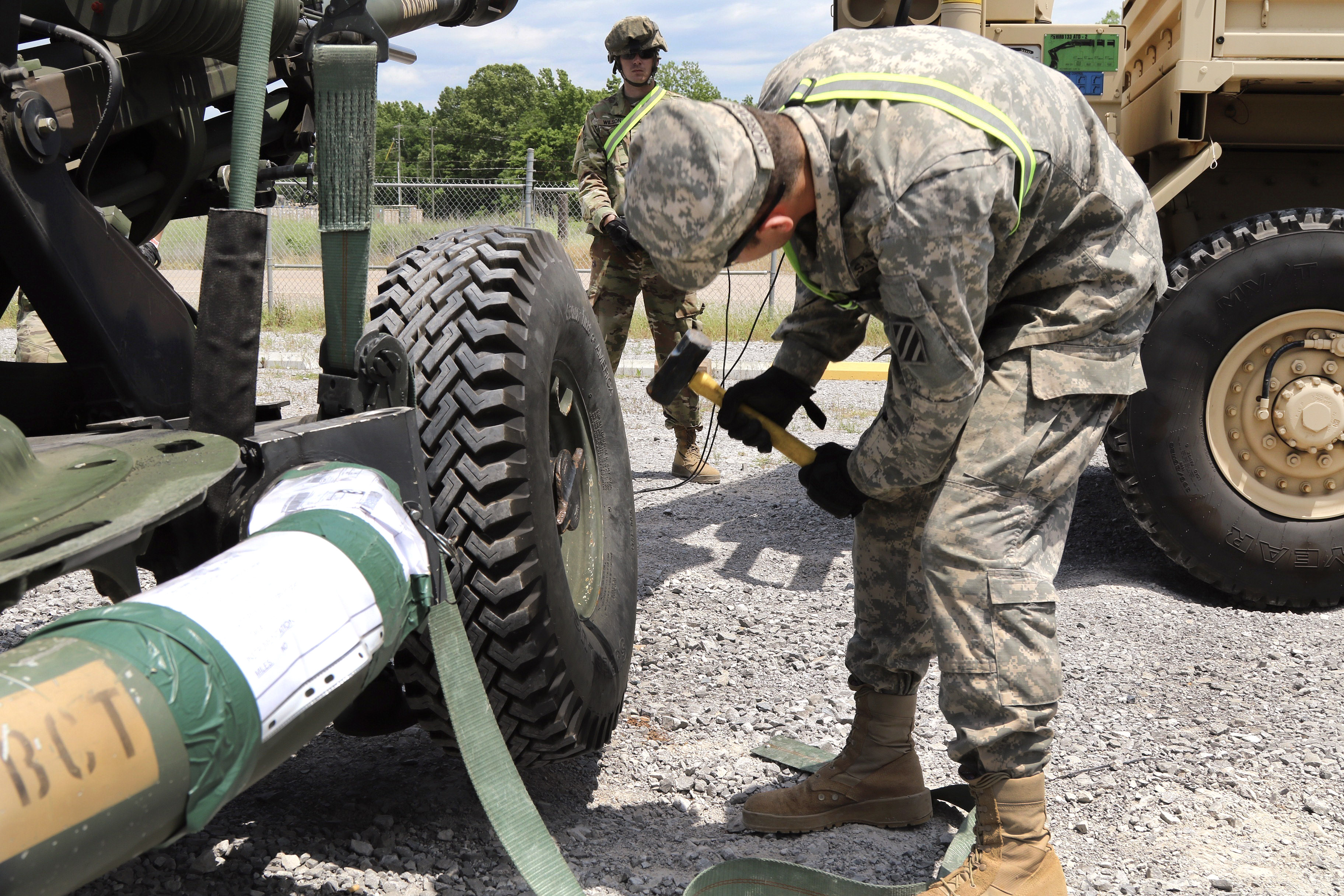 Hammering A Tire | U.S. Department of War