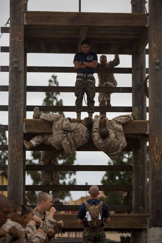 Recruits with Lima Company, 3rd Recruit Training Battalion, climb an ...