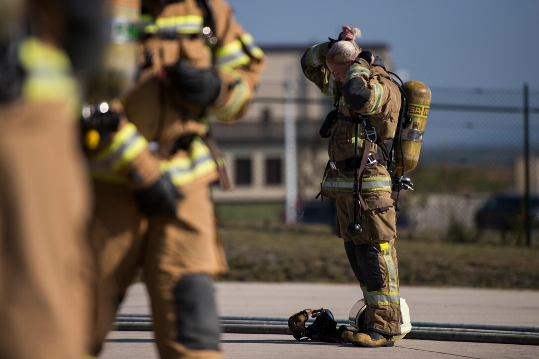 U.S. and NATO firefighters forge through the flames