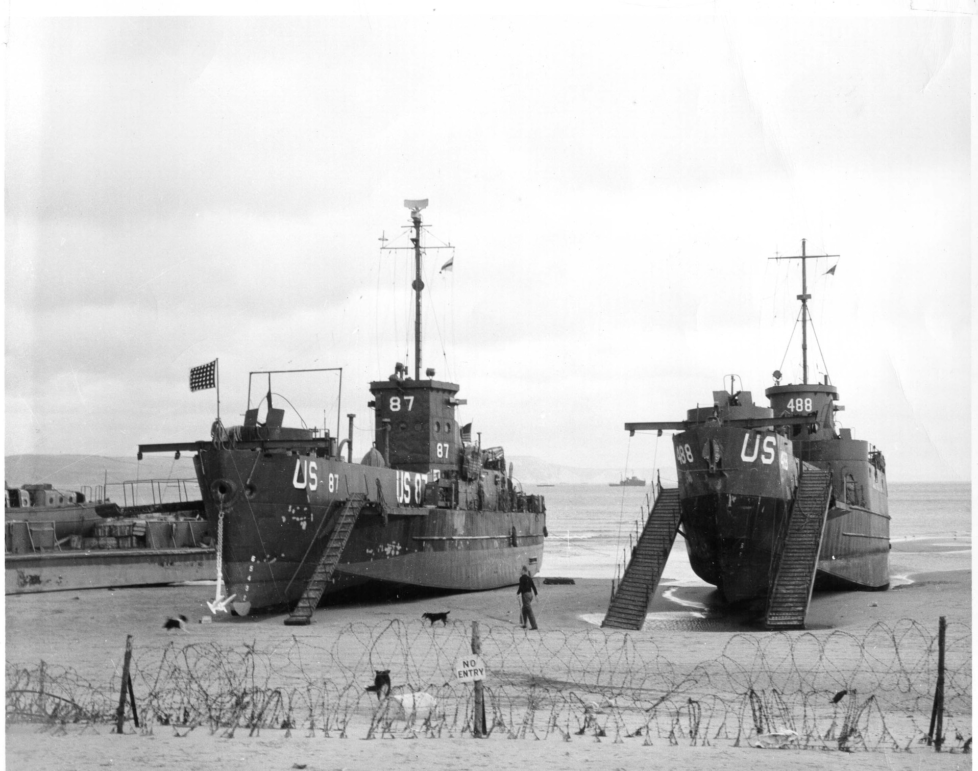 LCI(L)s 87 and 488 (Navy-manned) beached