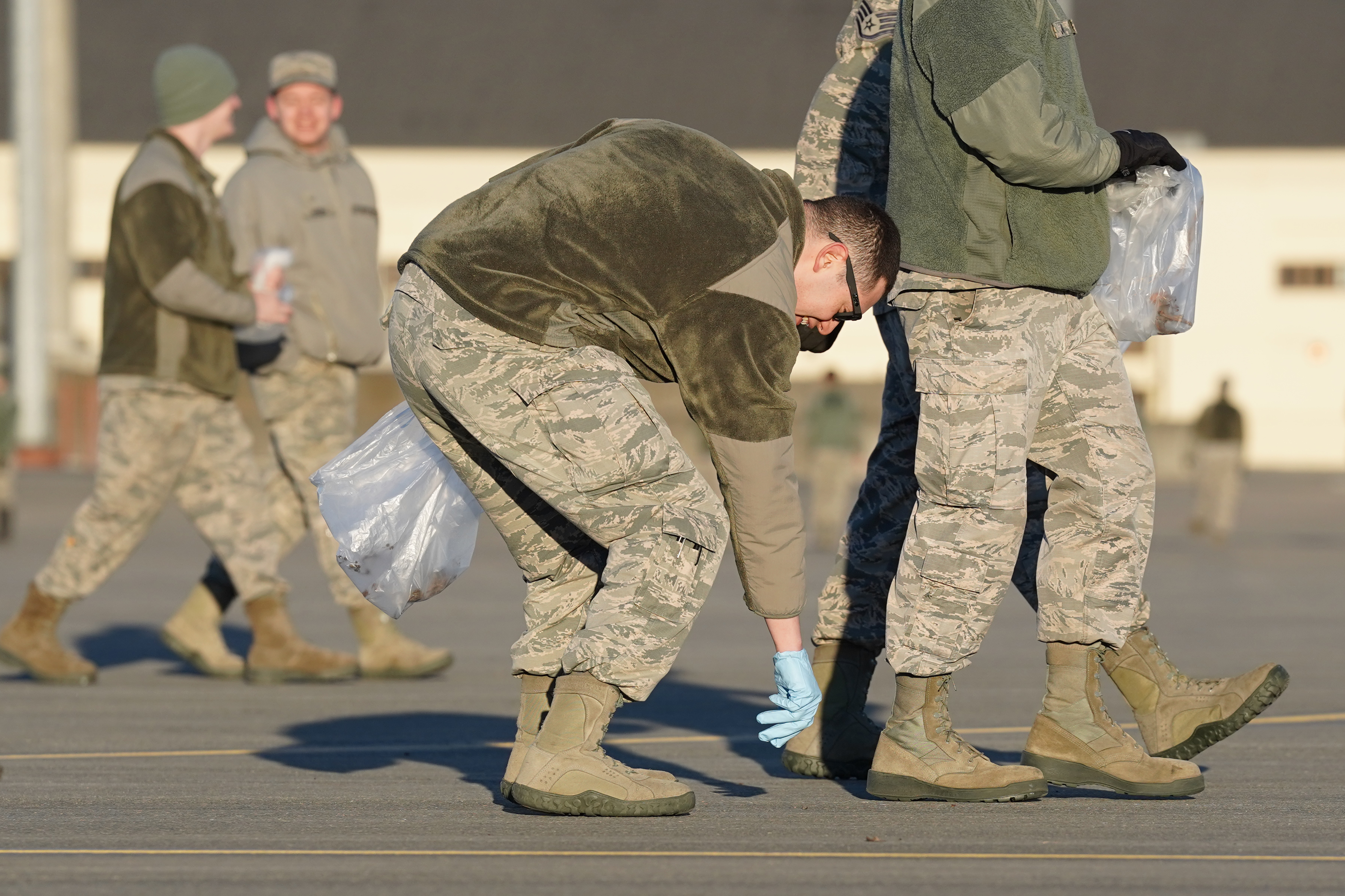 Airmen conduct a FOD walk