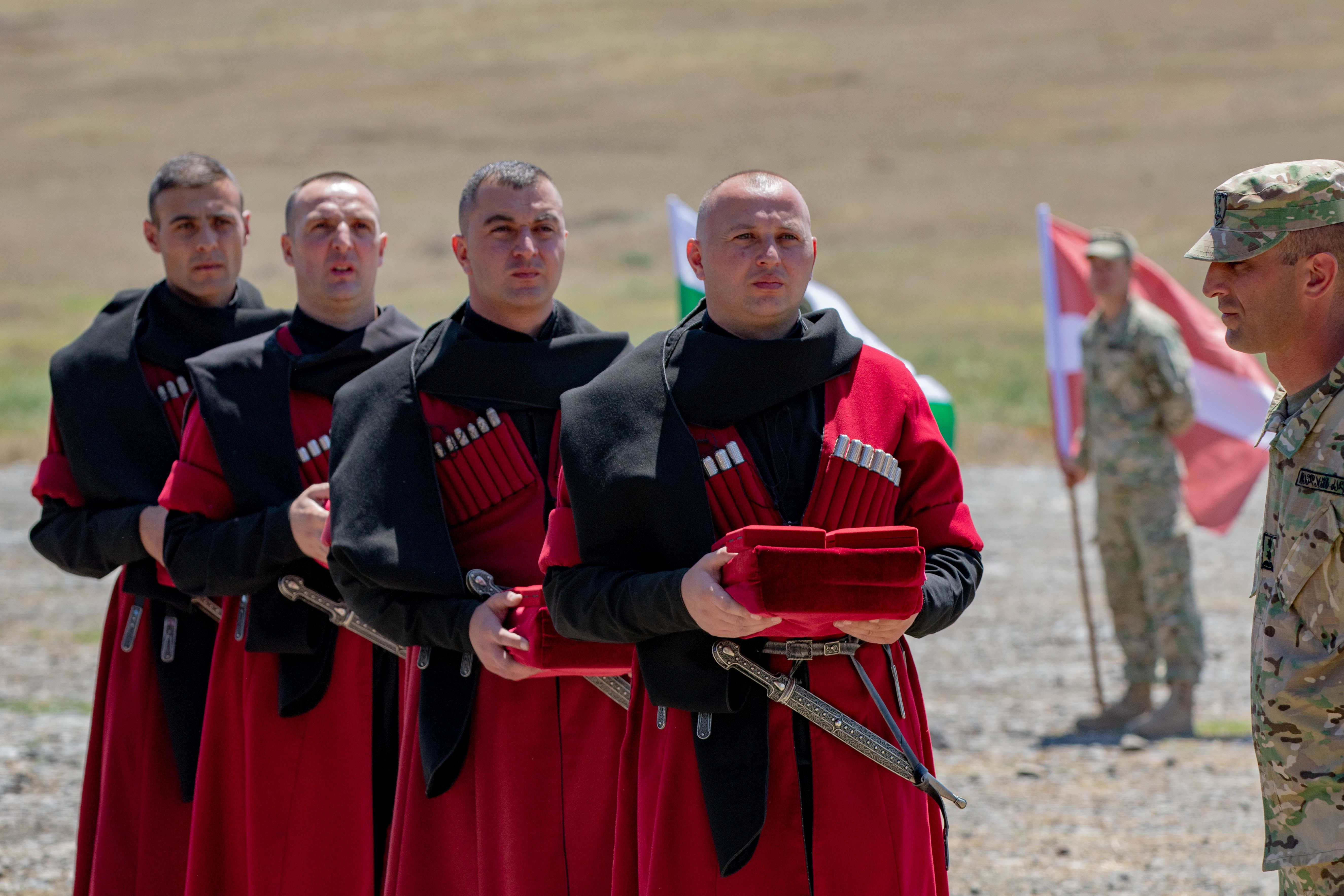 Georgian Defense Force soldiers wearing traditional Georgian uniforms