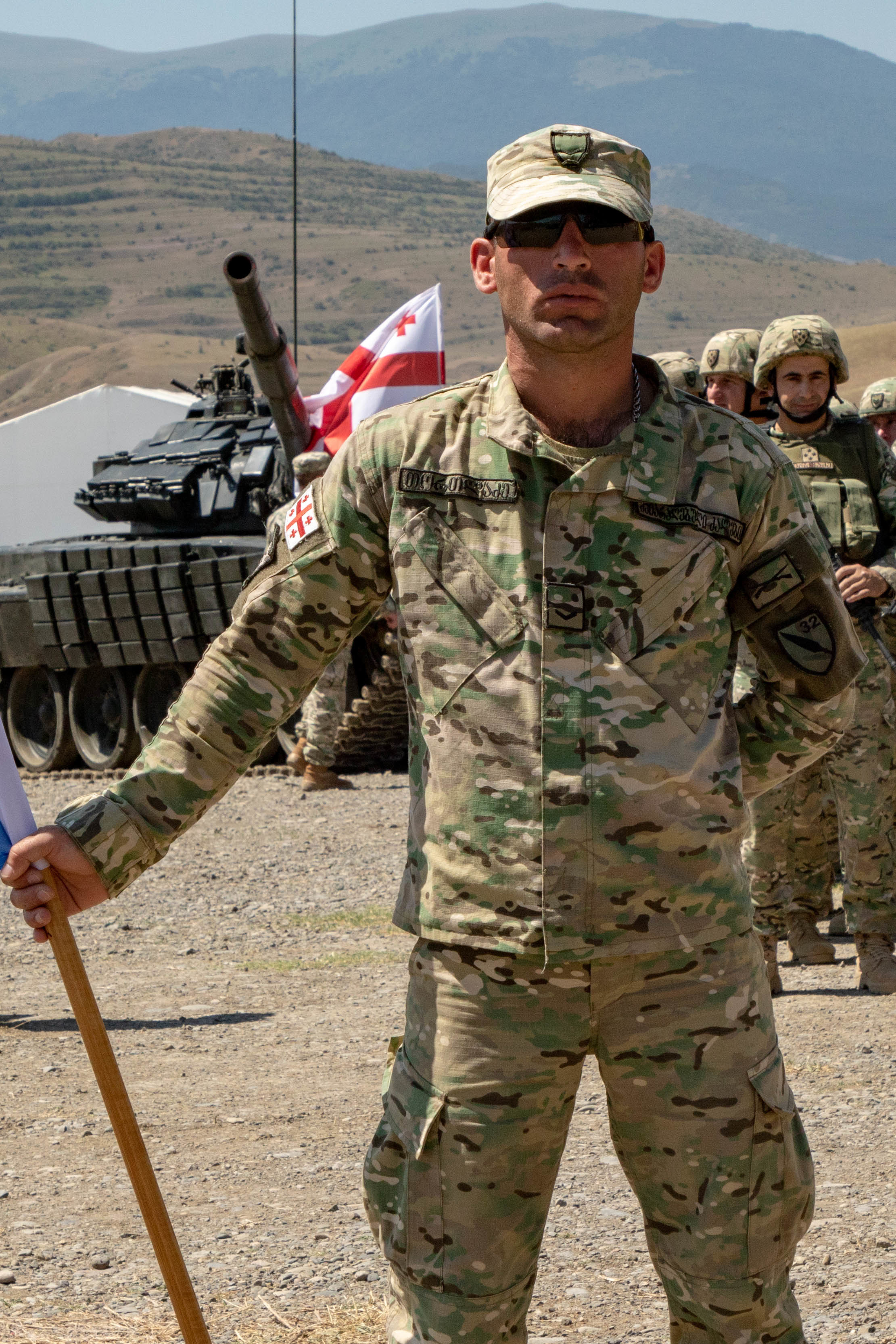 Multinational soldiers stand in formation during the closing ceremony ...