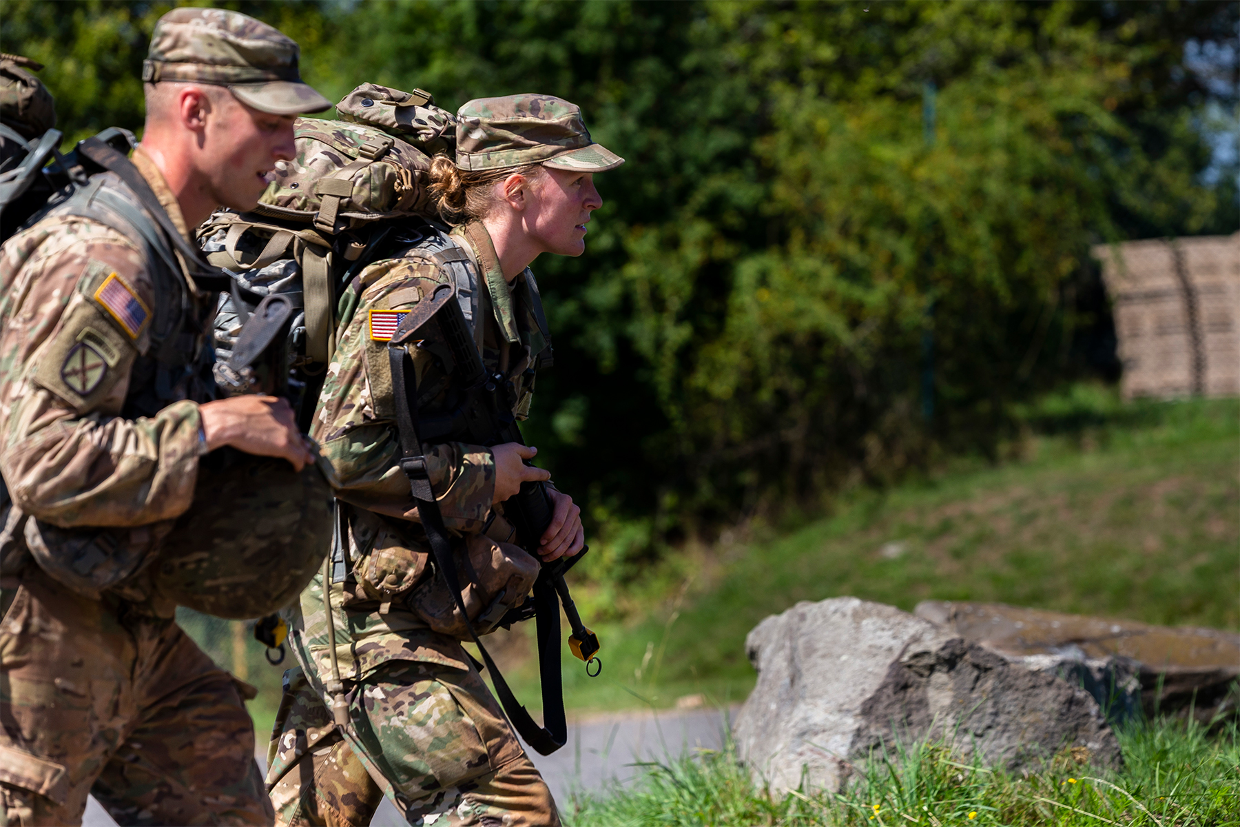 Army Sgt. Jake Weingarts, left, and Lt. Laura Benz walk to the next ...