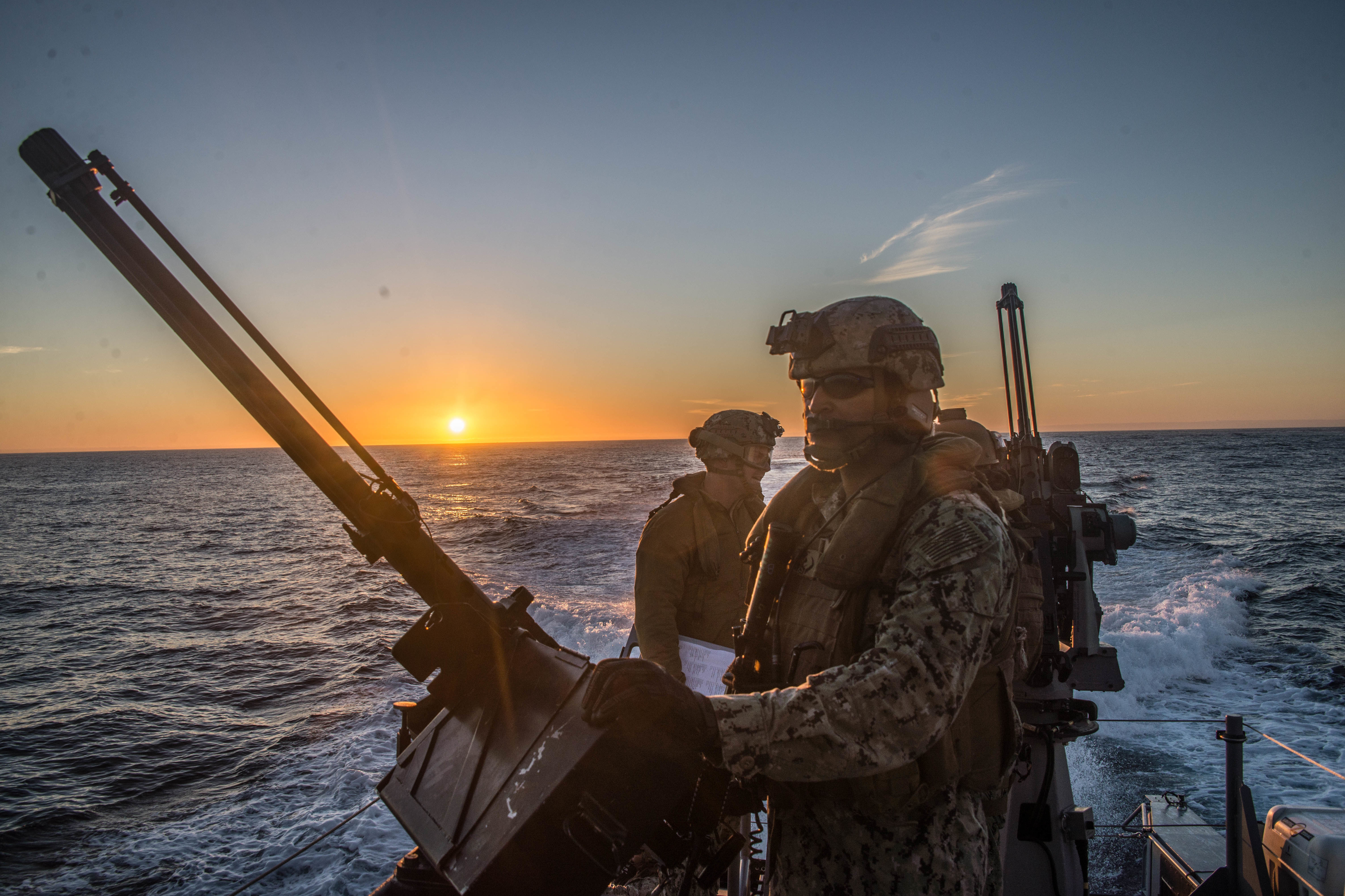 Sailors assigned to a Coastal Riverine Squadron patrol boat escort the ...