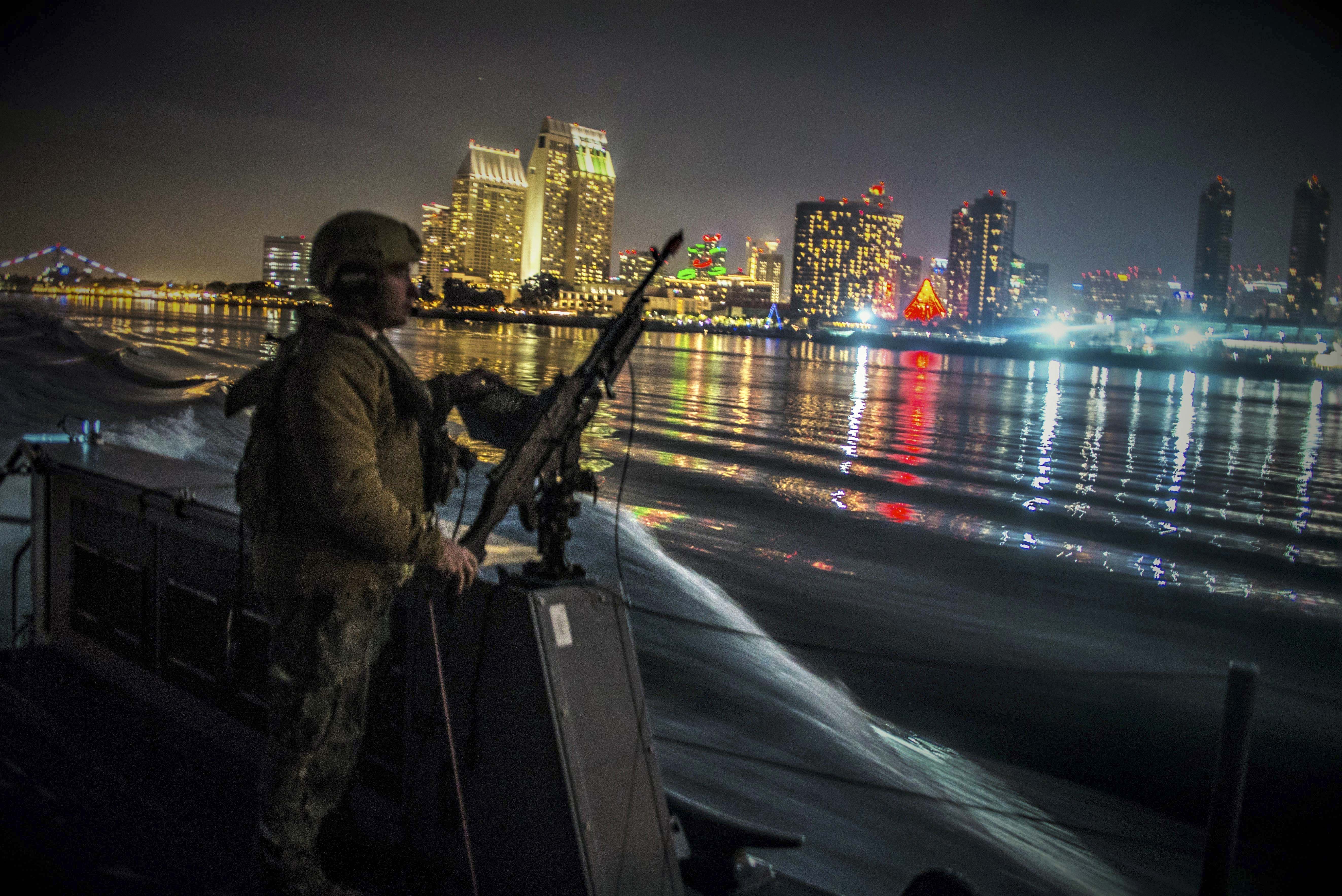 Navy Petty 2nd Class Officer Vincent Dahl mans a M240 machine gun ...