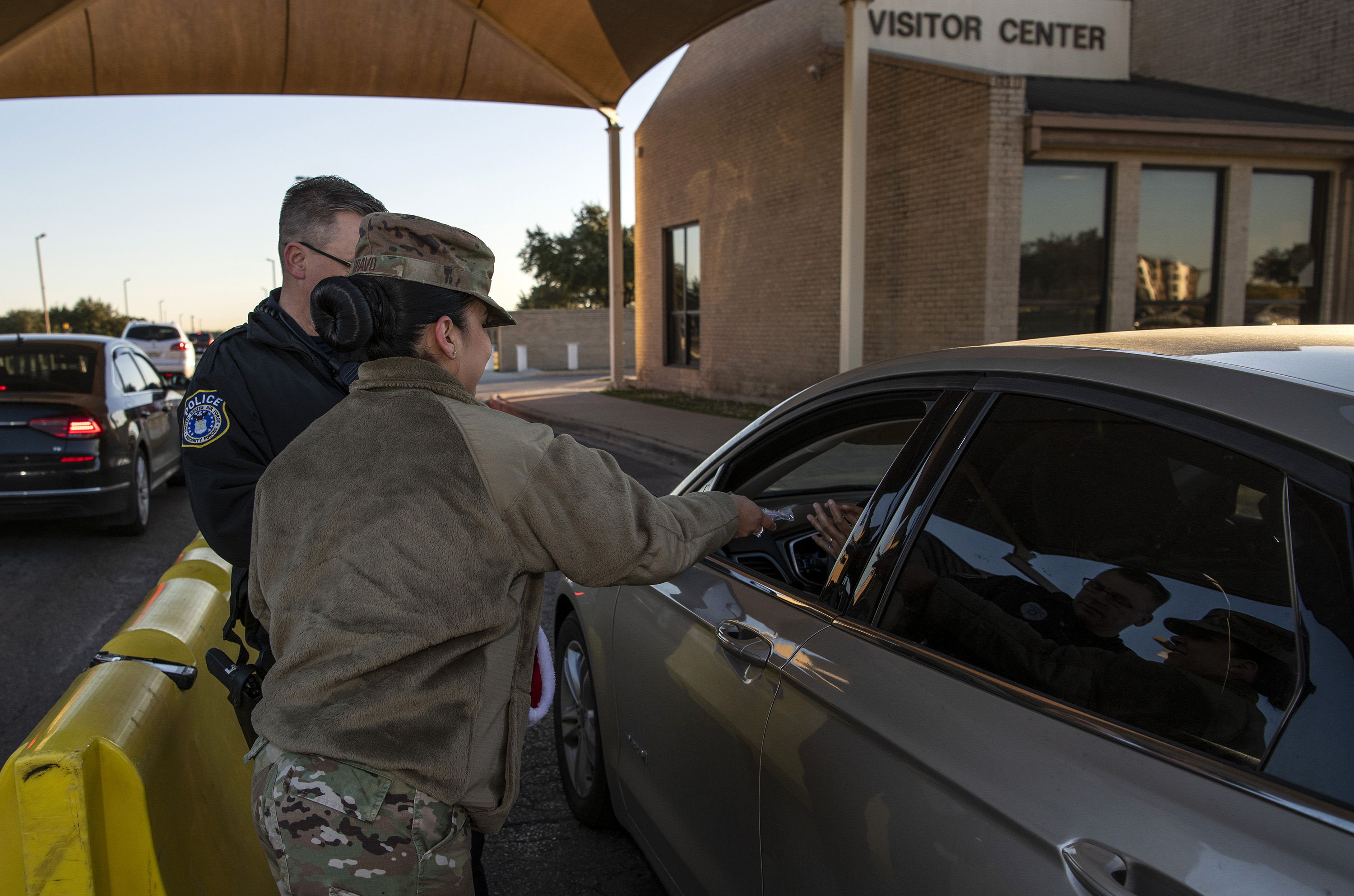 Volunteers show commuters ‘We Care’ at JBSA-Lackland entry gates ...