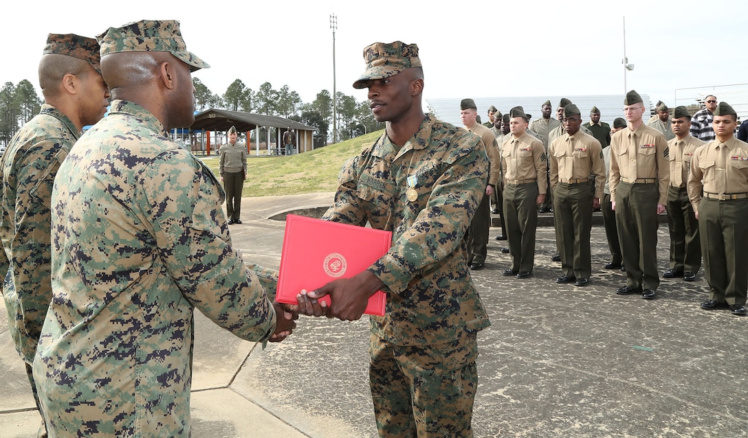LOGCOM Marine receives promotion, medal