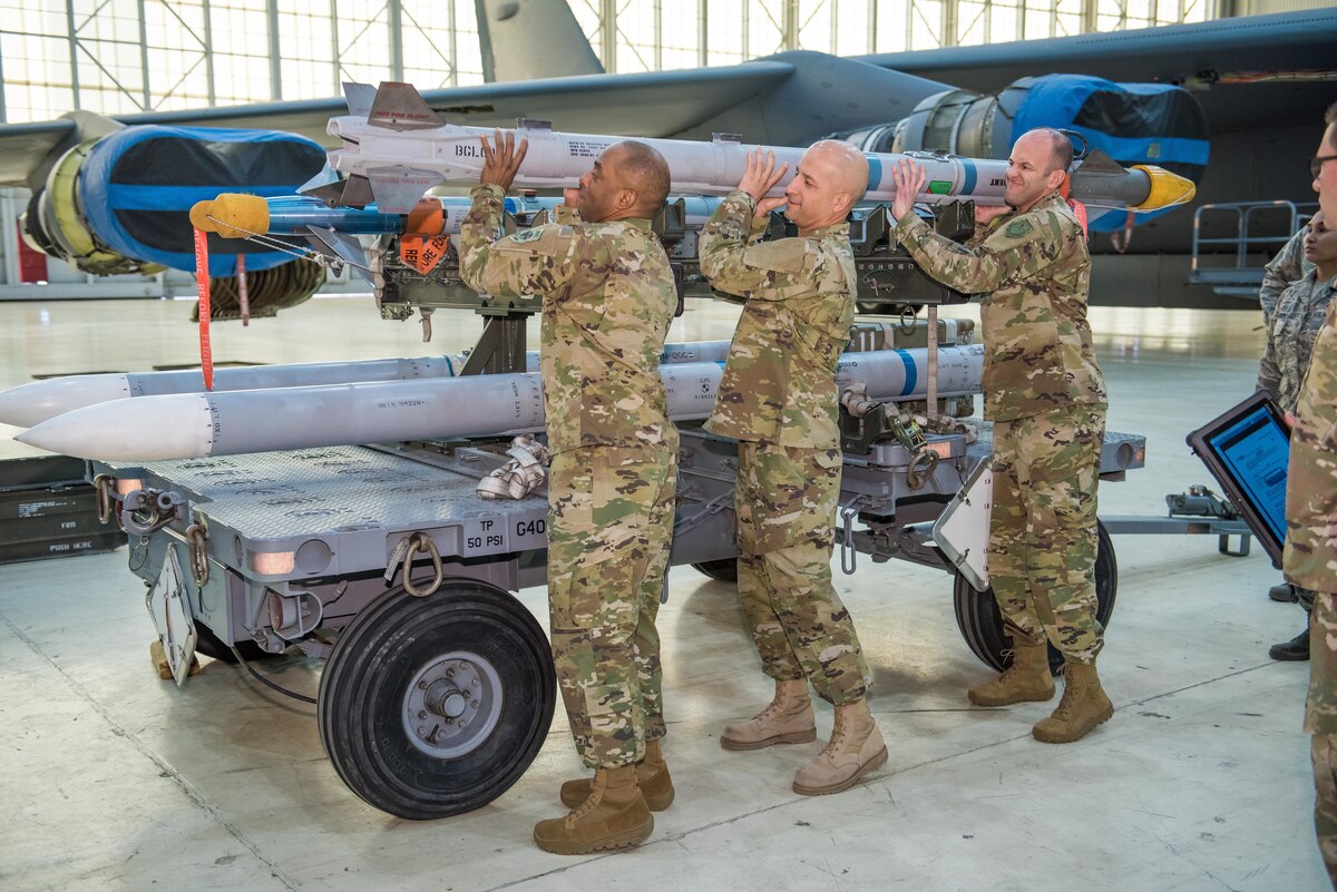 Test wing commander, chief, experience weapons loading first-hand ...