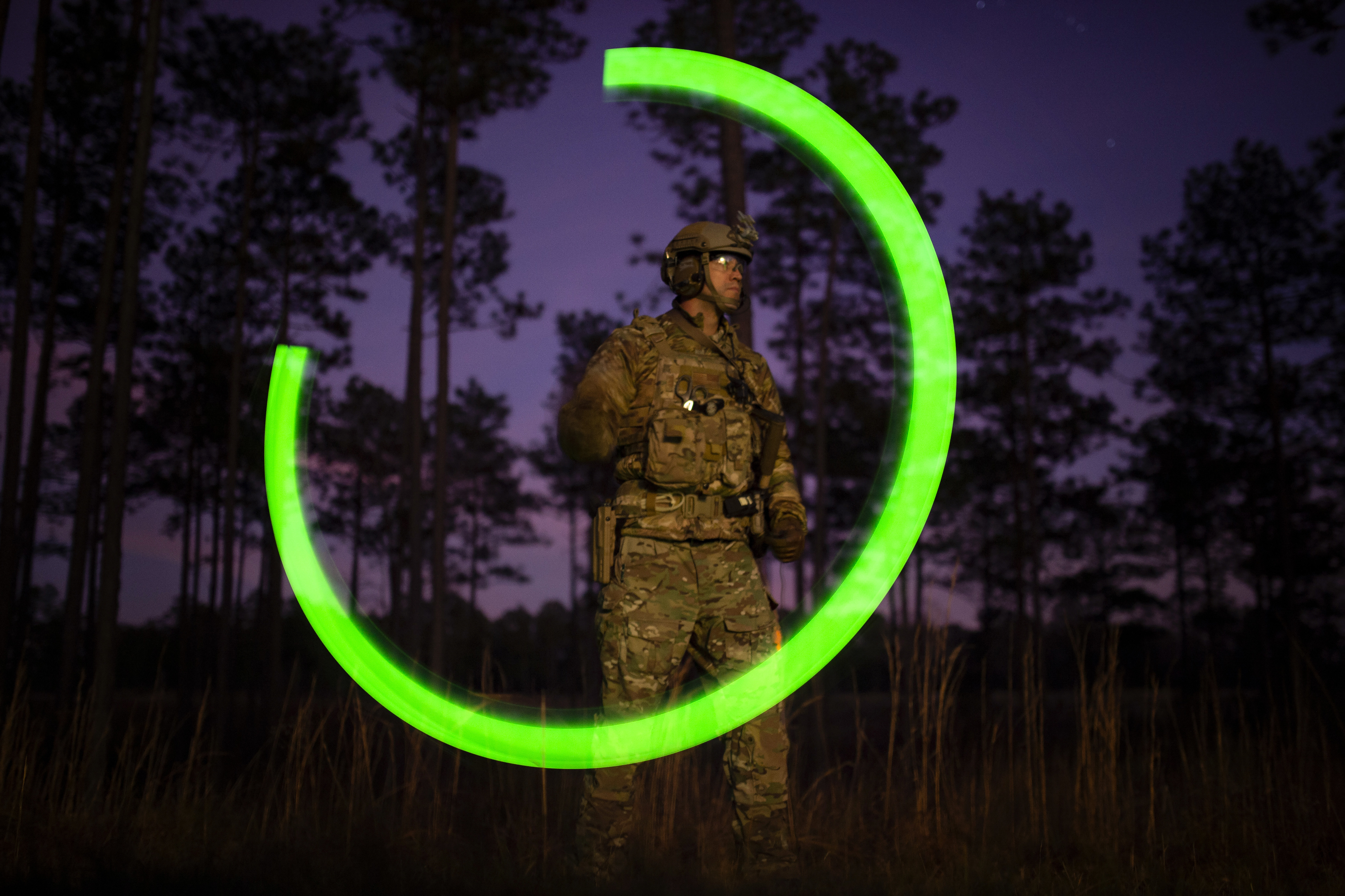 soldier demonstrates light signals during live-fire training at Camp ...