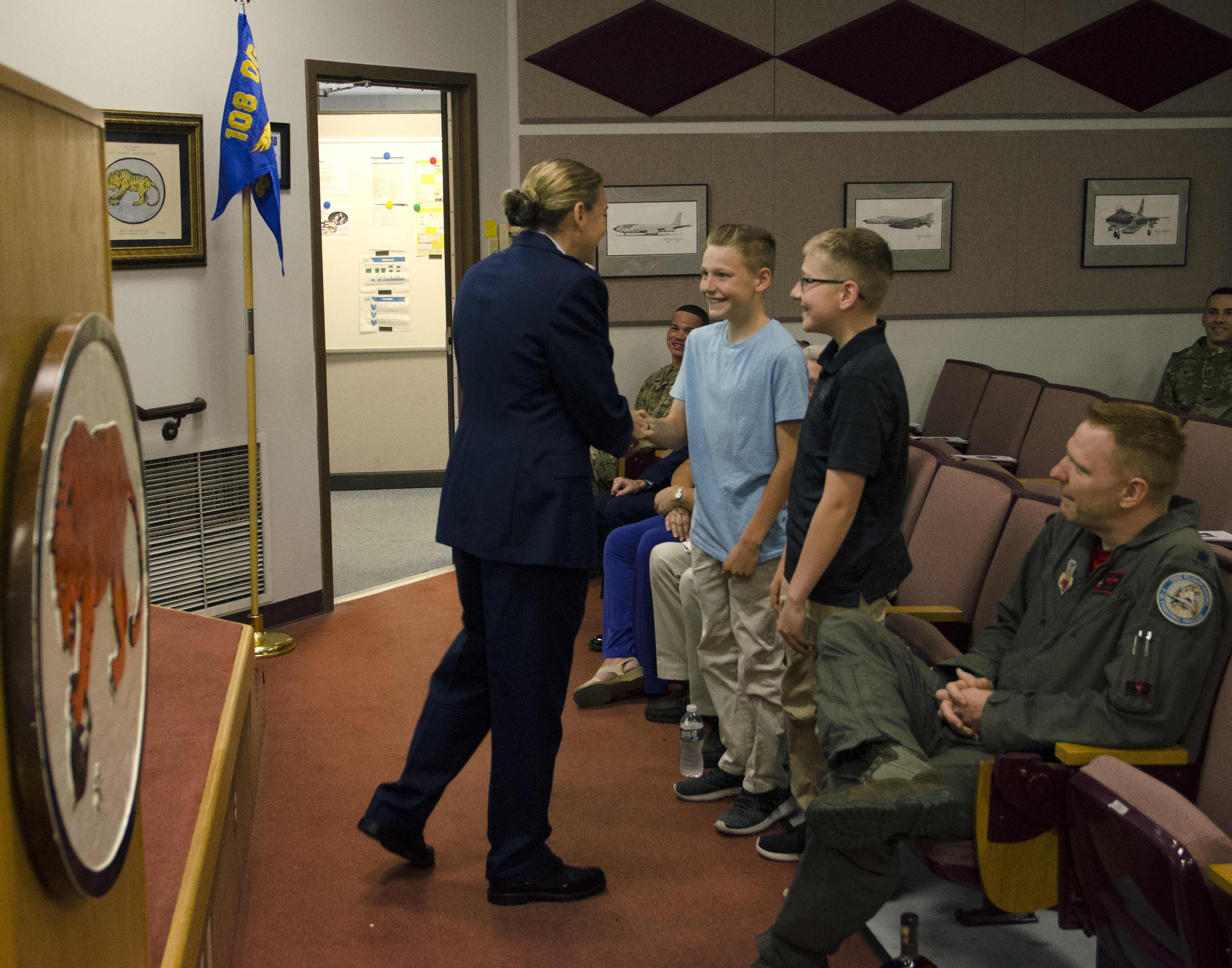 Lt. Col. Stein gives coins to her children