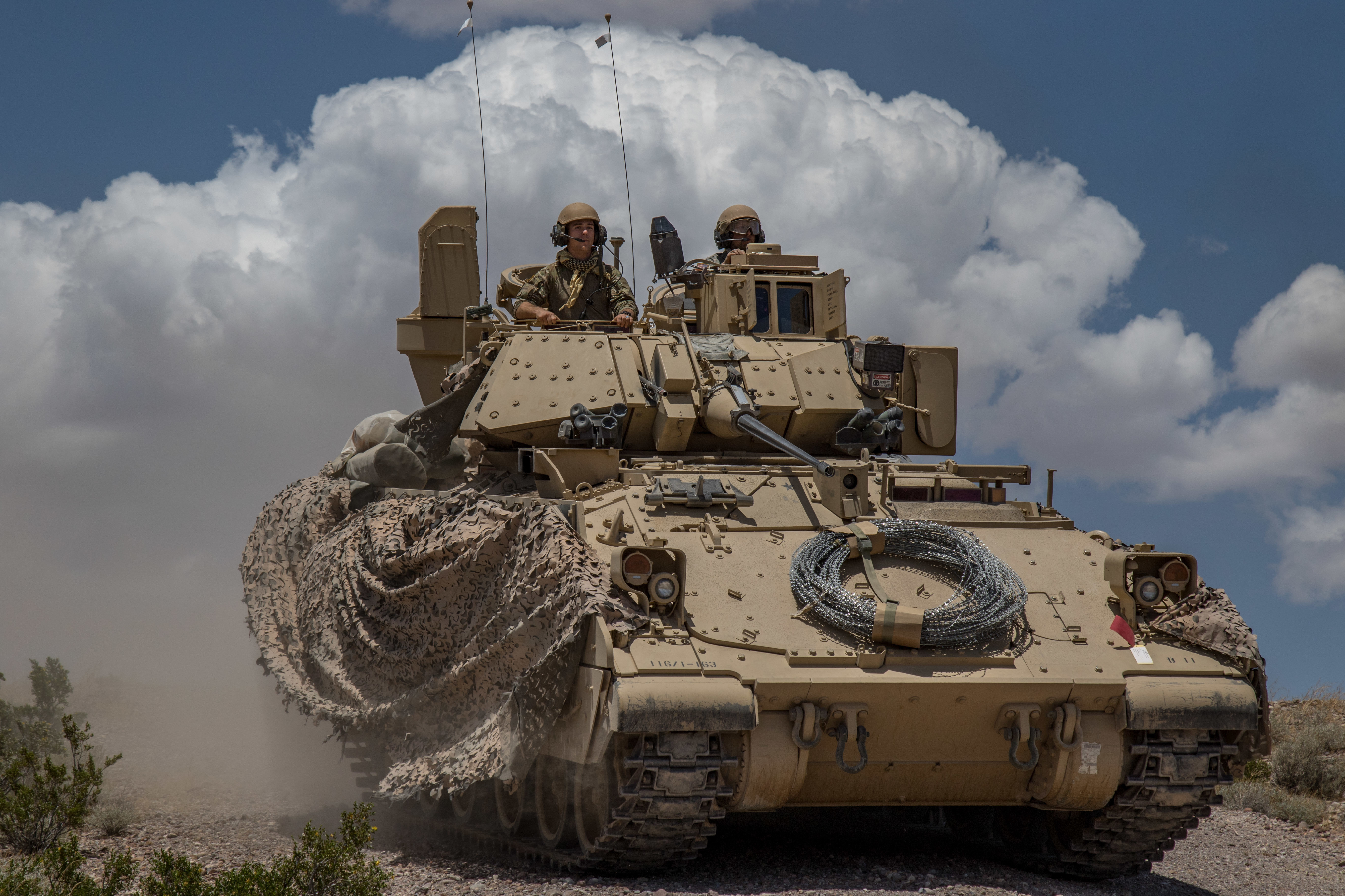 Soldiers push on in a Bradley fighting vehicle during defensive attack ...