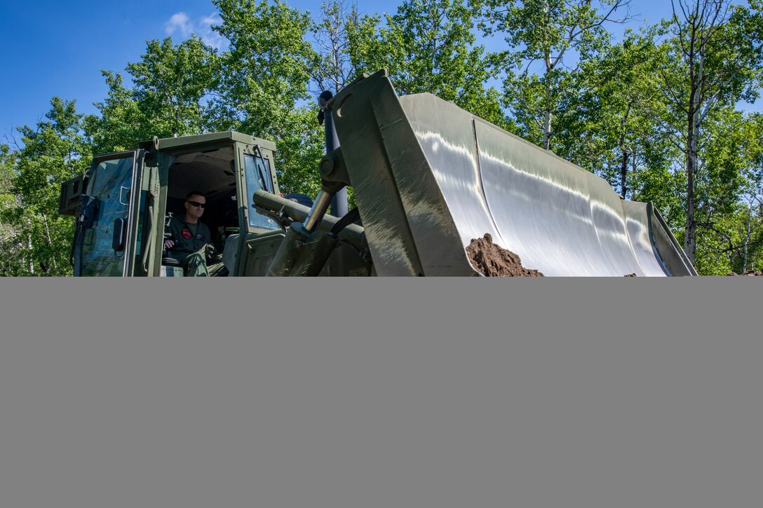 U.S. Marines with MWSS-471 build a roadway at Canadian Forces Base Cold ...