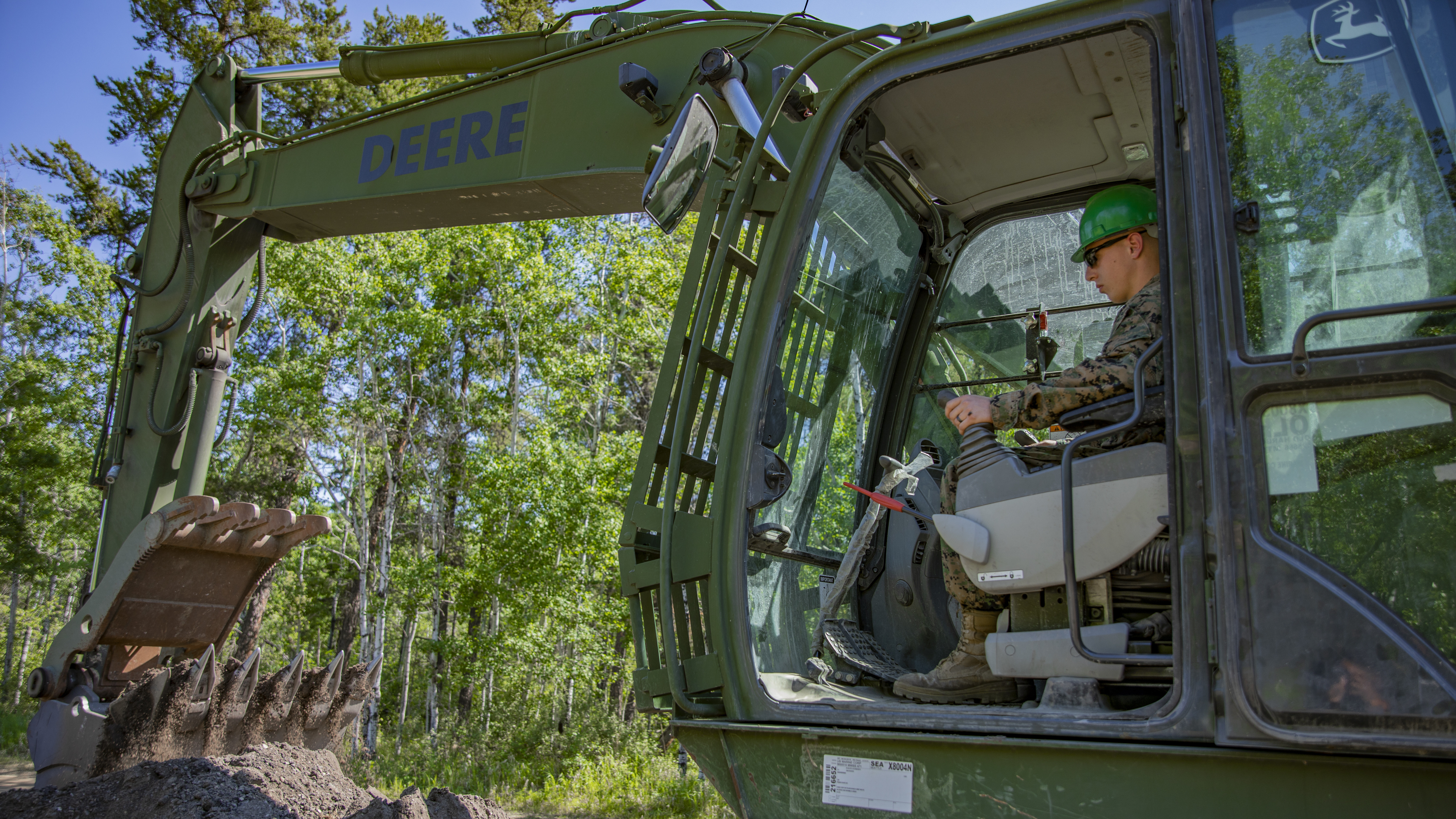 U.S. Marines with MWSS-471 build a roadway at Canadian Forces Base Cold ...