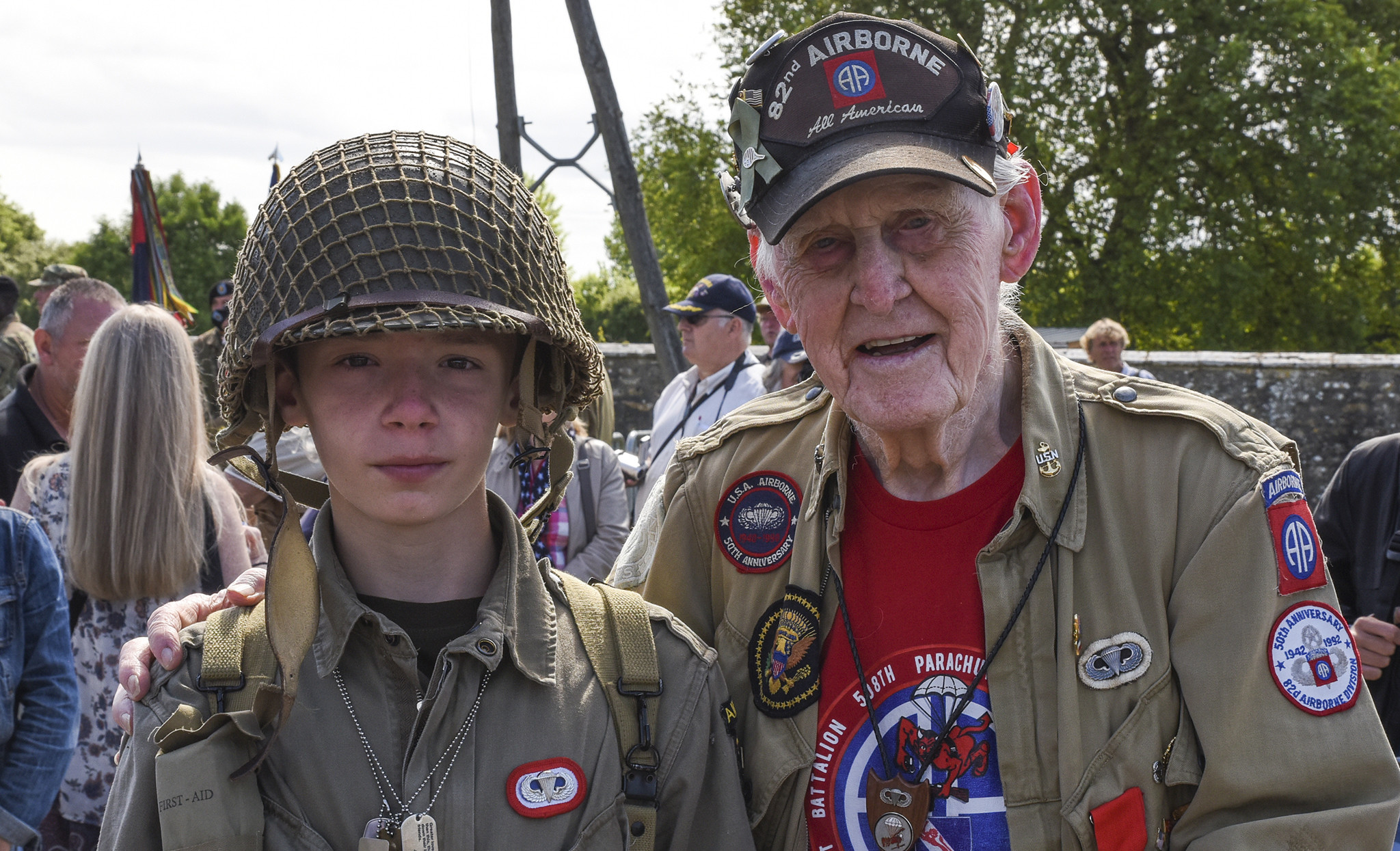 World War II veteran Ernie Lamson poses with a friend in Angoville-au ...