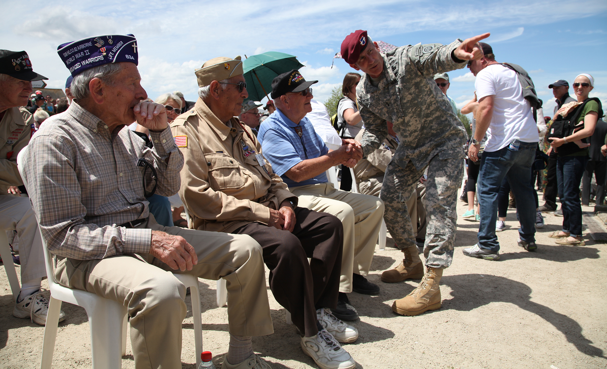 Maj. Gen. John W. Nicholson Jr., speaks with World War 2 veterans at a ...